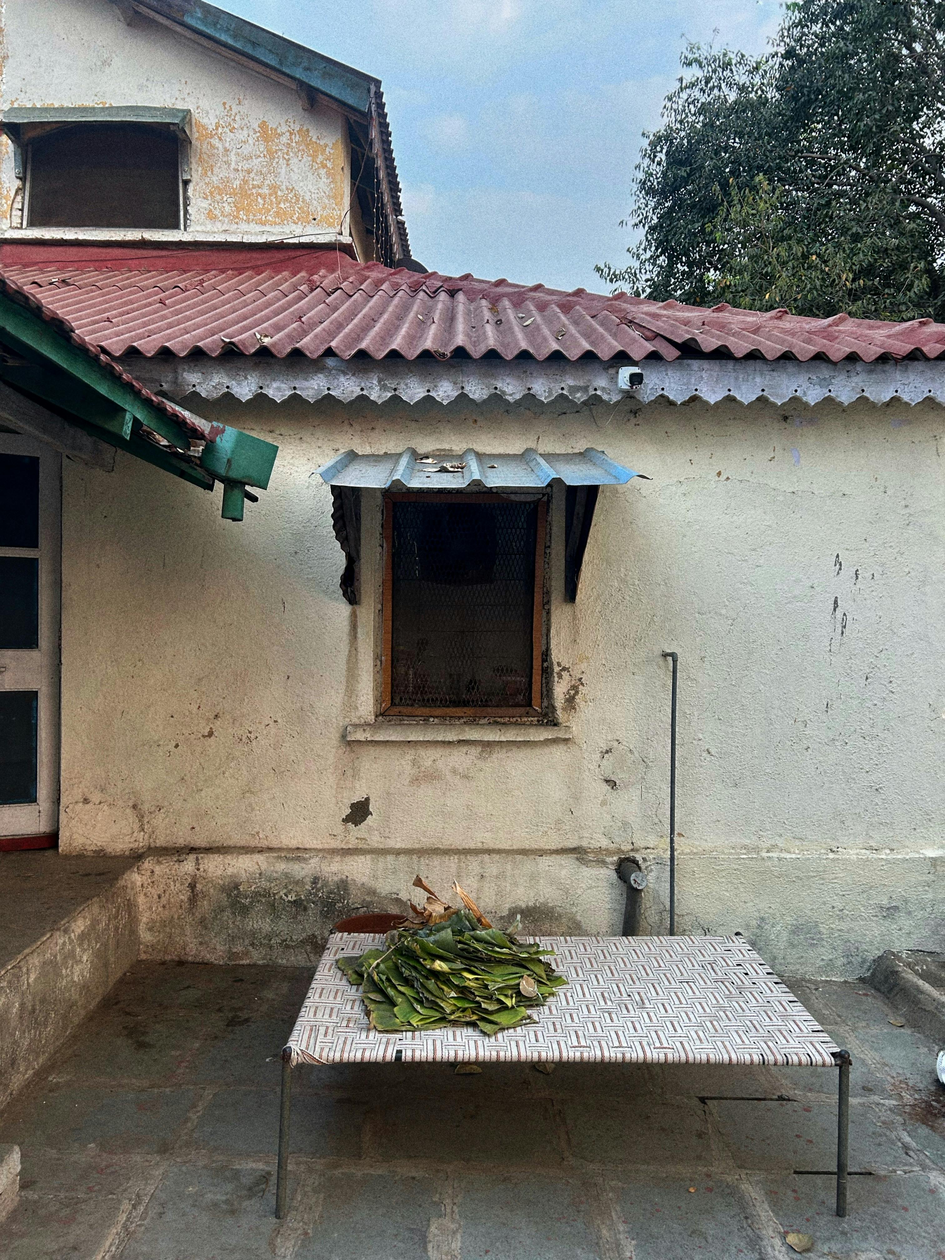 Rural Courtyard with Traditional Charpai · Free Stock Photo