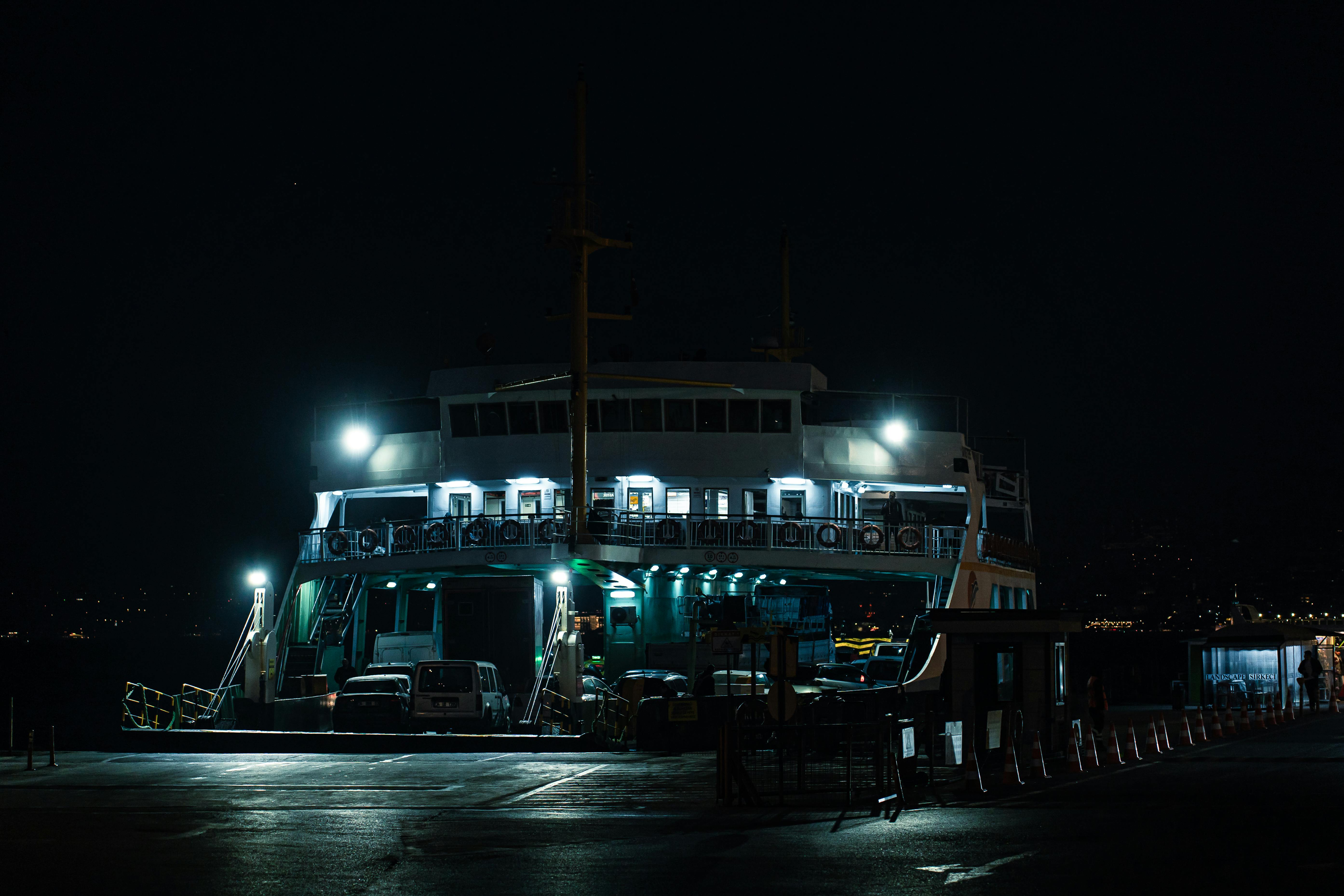 Nighttime Ferry Dock Scene with Illuminated Lights · Free Stock Photo
