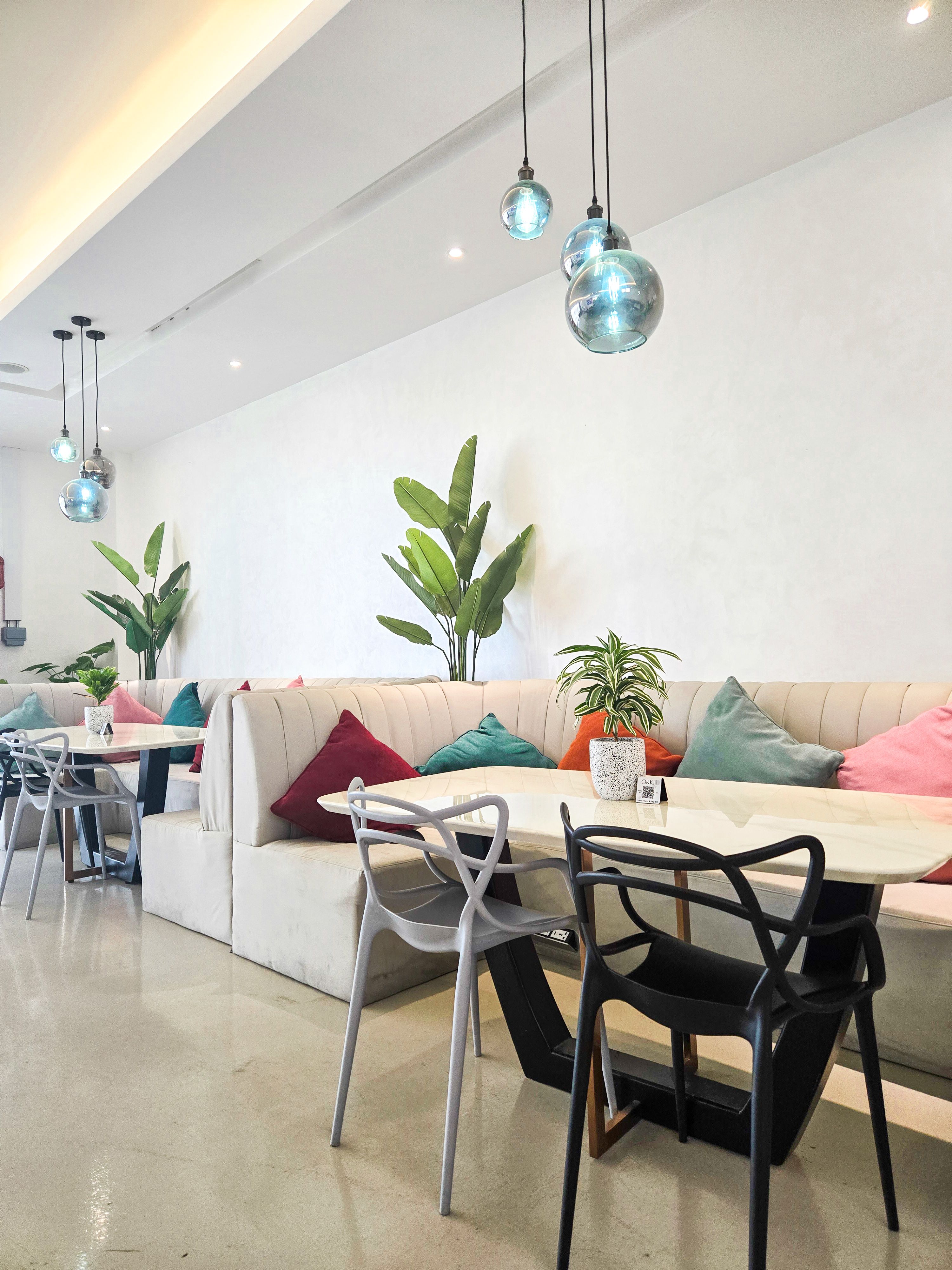 Modern Café Interior with Colorful Decor · Free Stock Photo