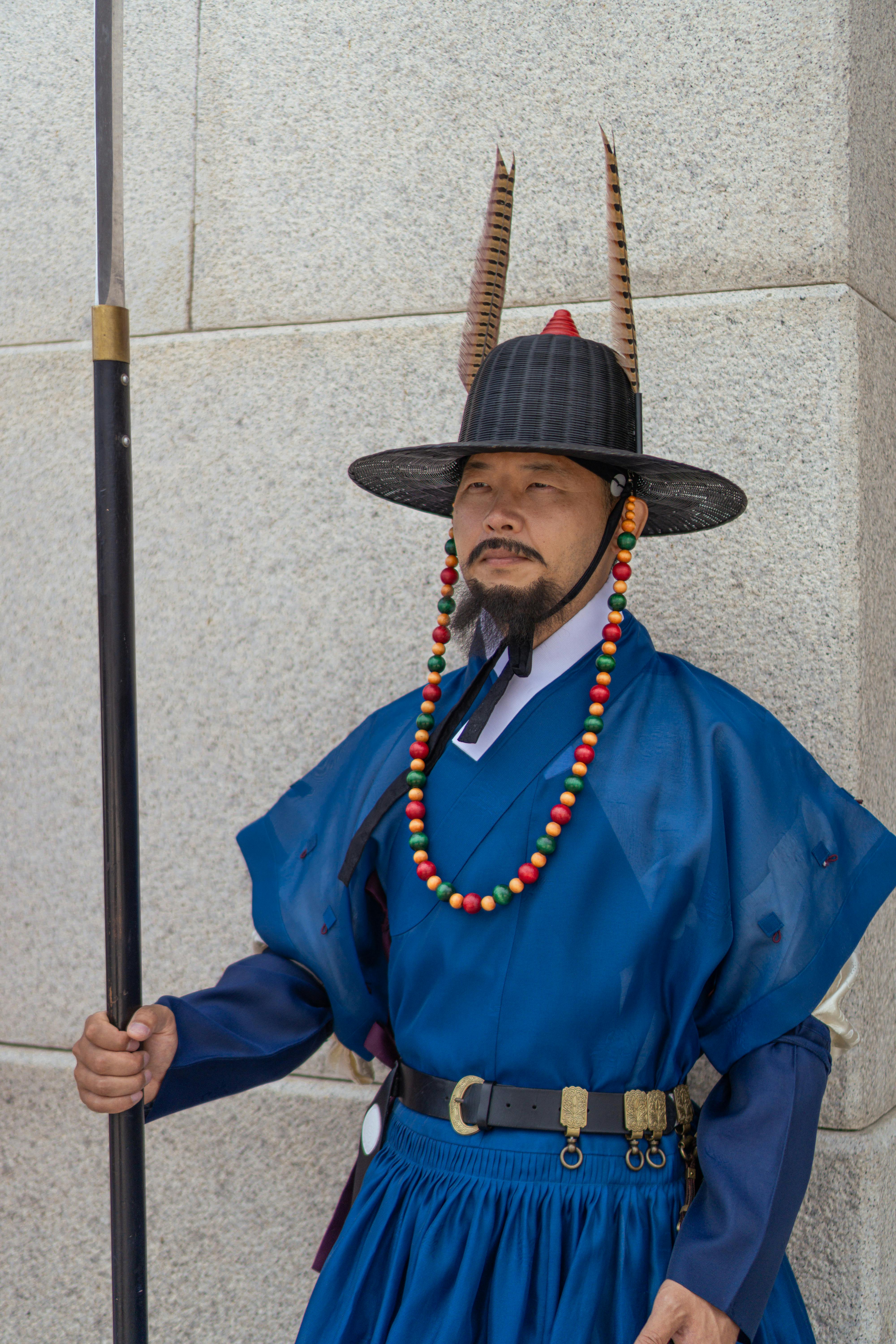 Traditional Korean Guard in Ceremonial Attire · Free Stock Photo