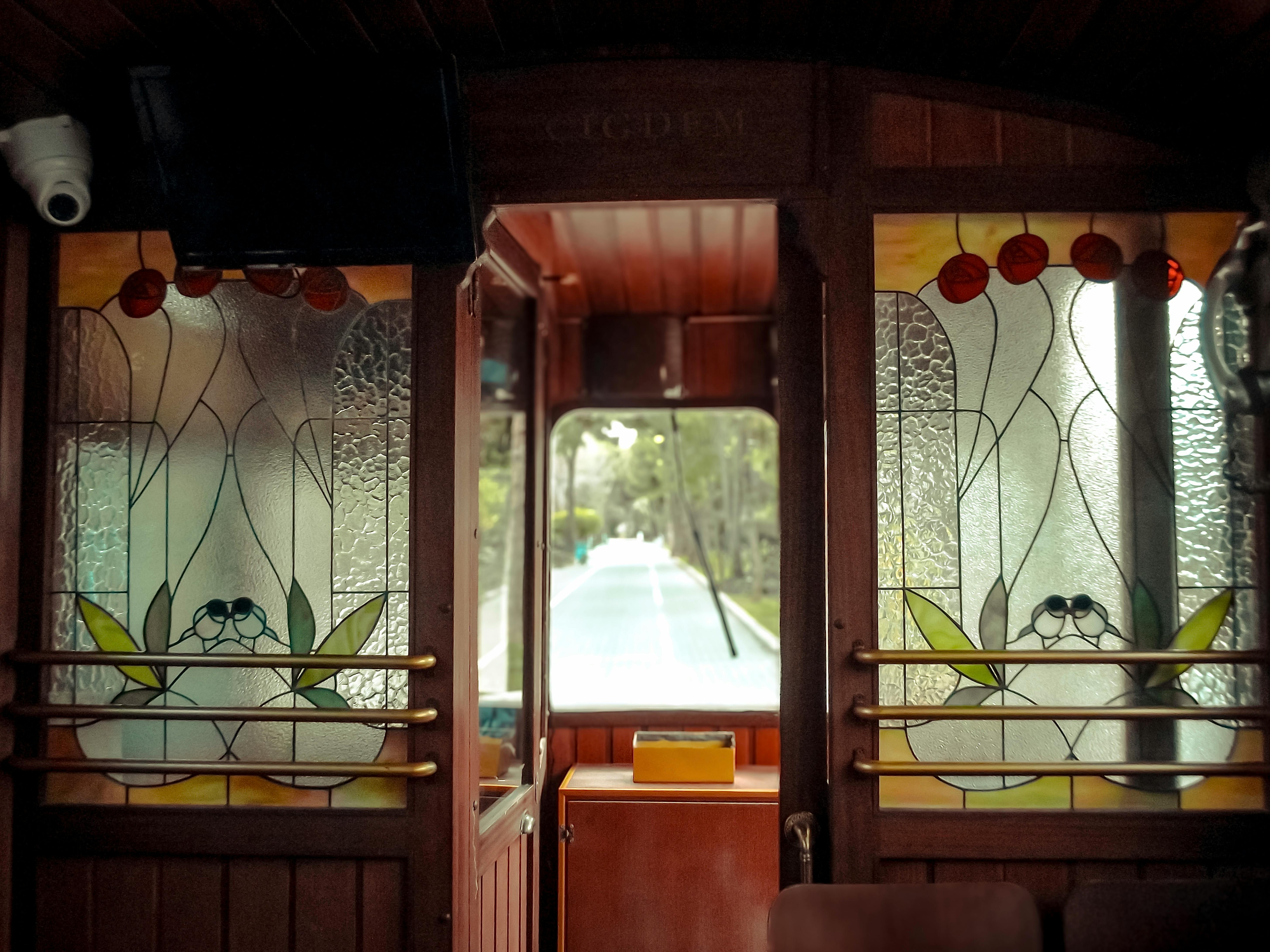 Beautiful Stained Glass Windows in Rustic Train · Free Stock Photo