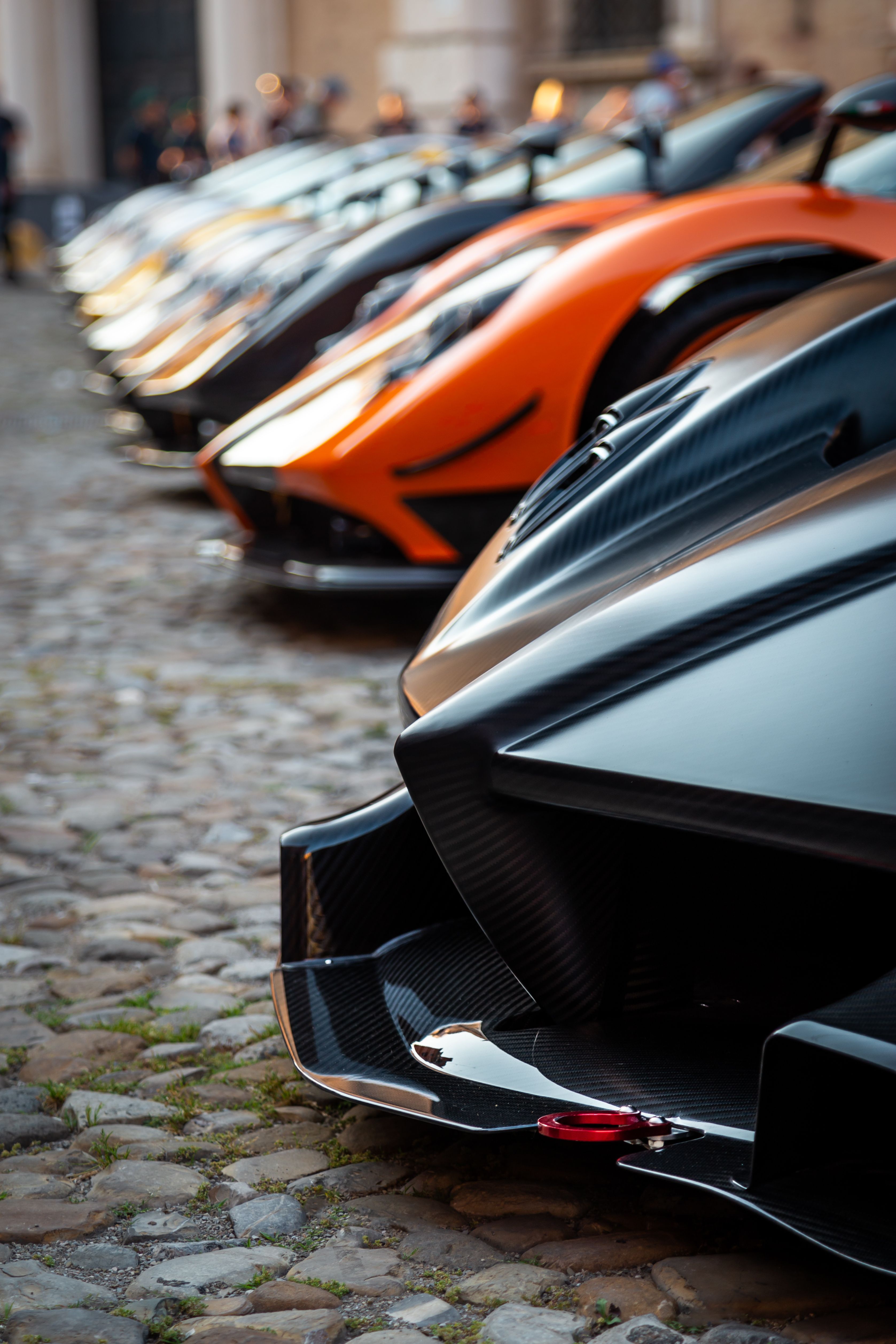 Sleek Lineup of Luxury Sports Cars Outdoors · Free Stock Photo