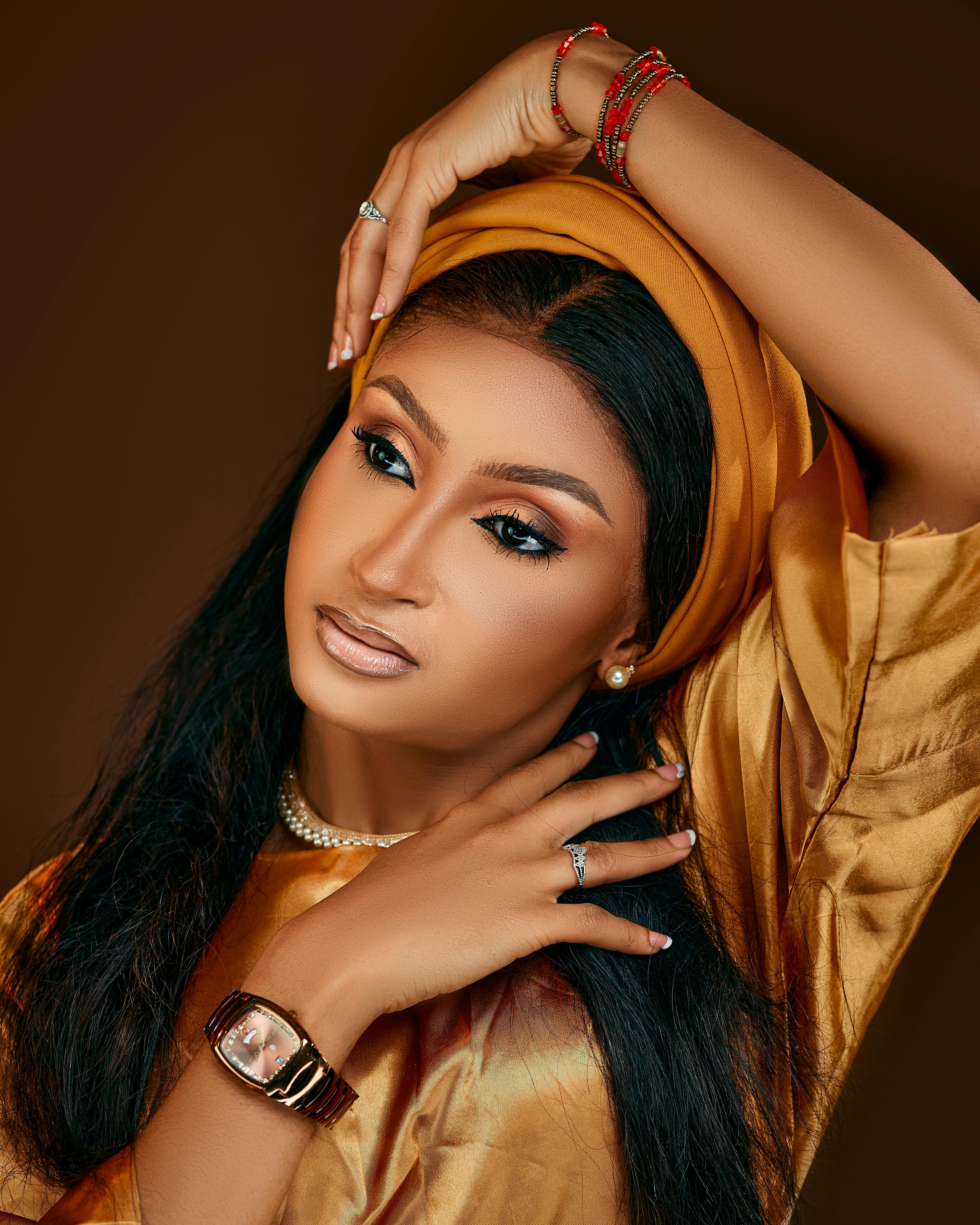 Elegant Portrait of Woman in Golden Attire · Free Stock Photo