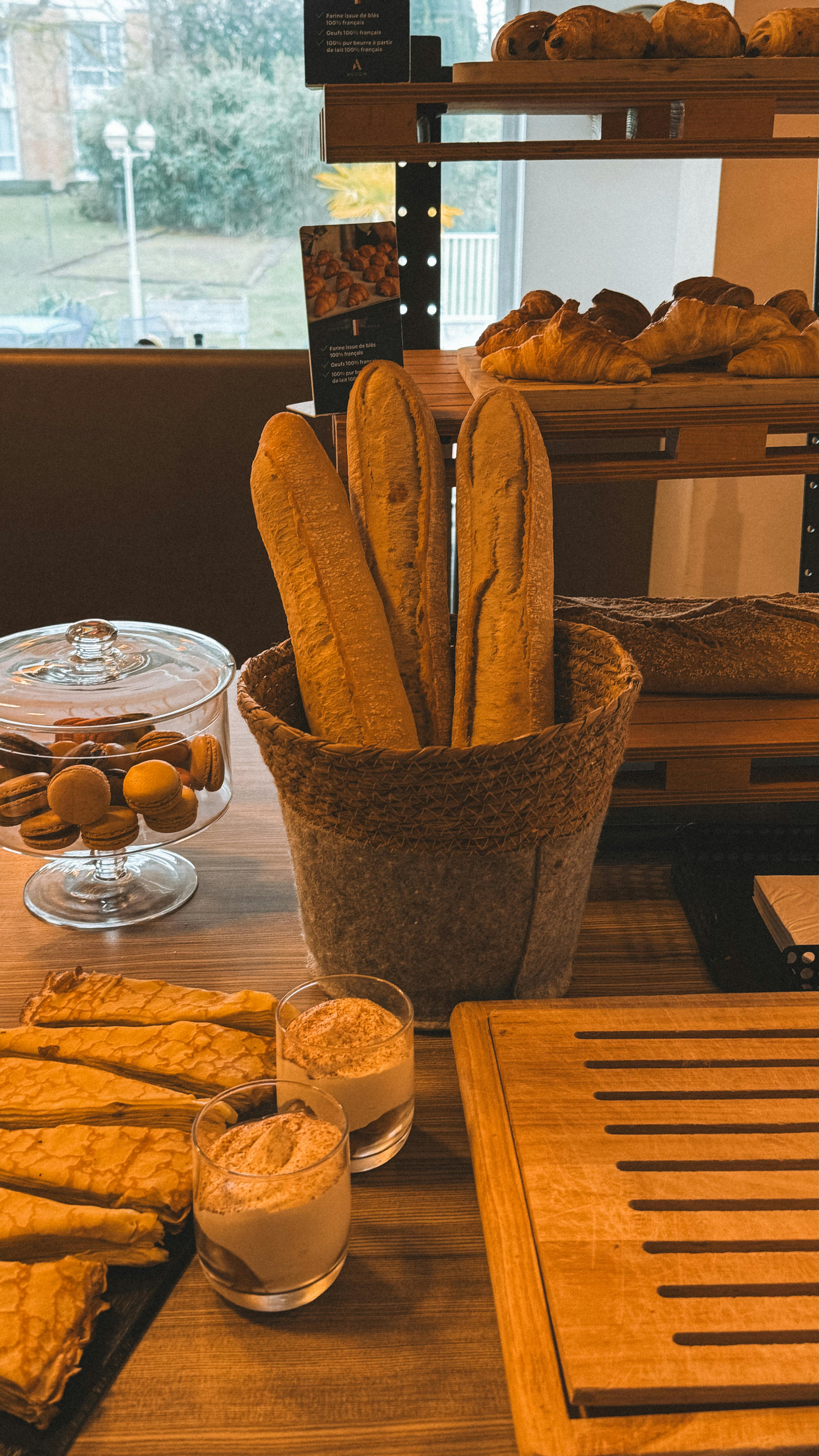 Cozy Bakery Display with Fresh Baguettes · Free Stock Photo