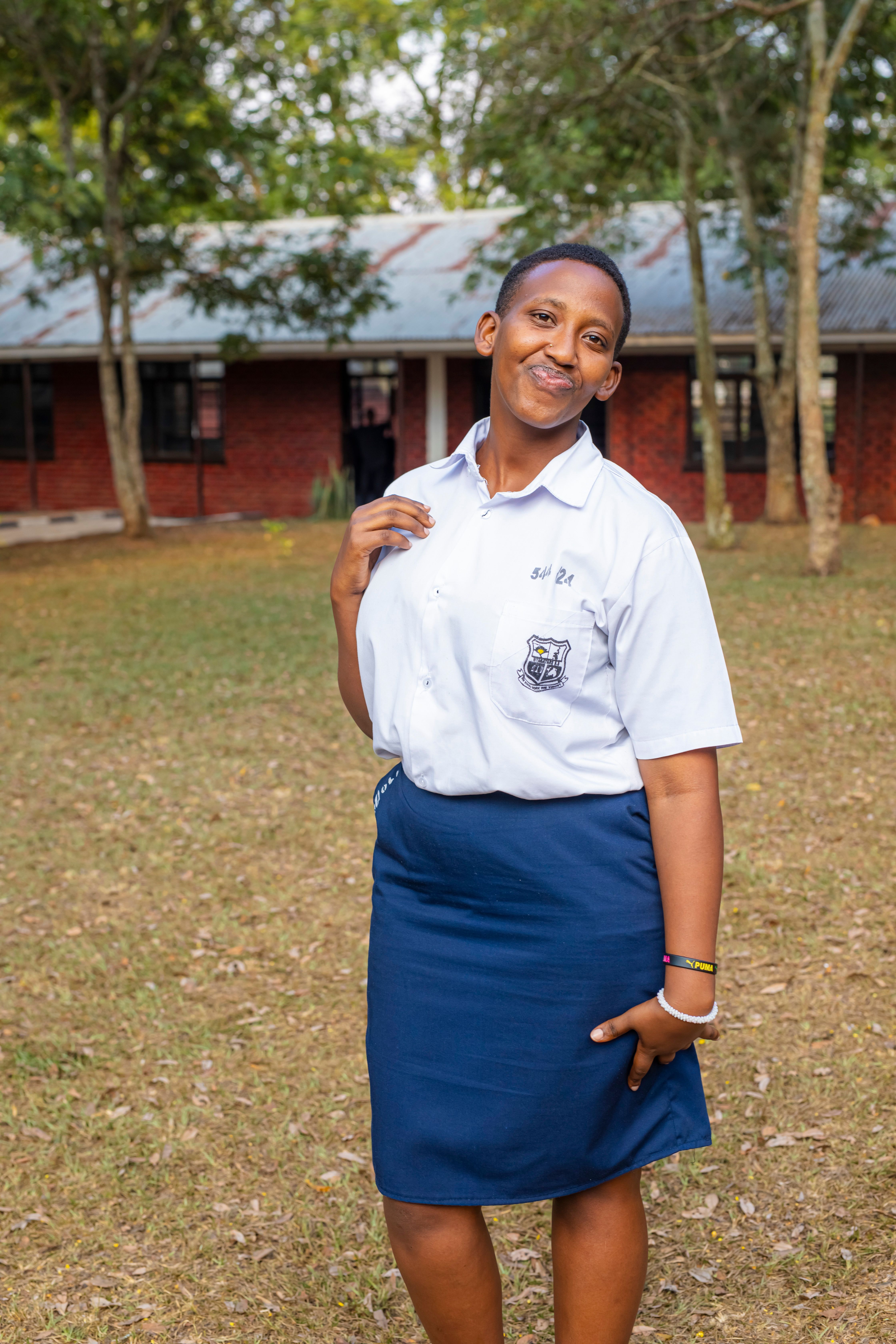 Smiling Student in School Uniform Outdoors · Free Stock Photo
