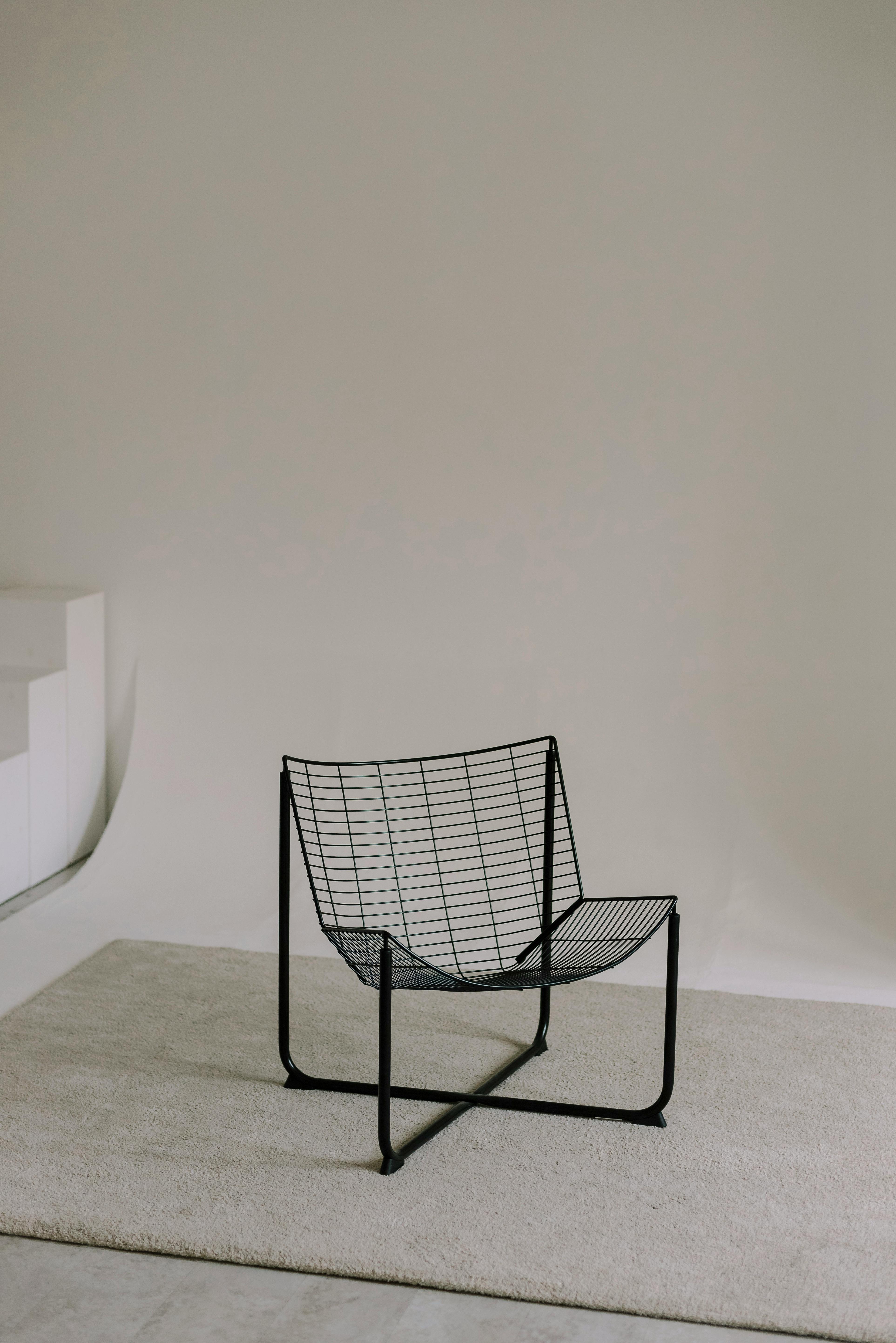 Minimalist Wire Chair on Beige Carpet · Free Stock Photo