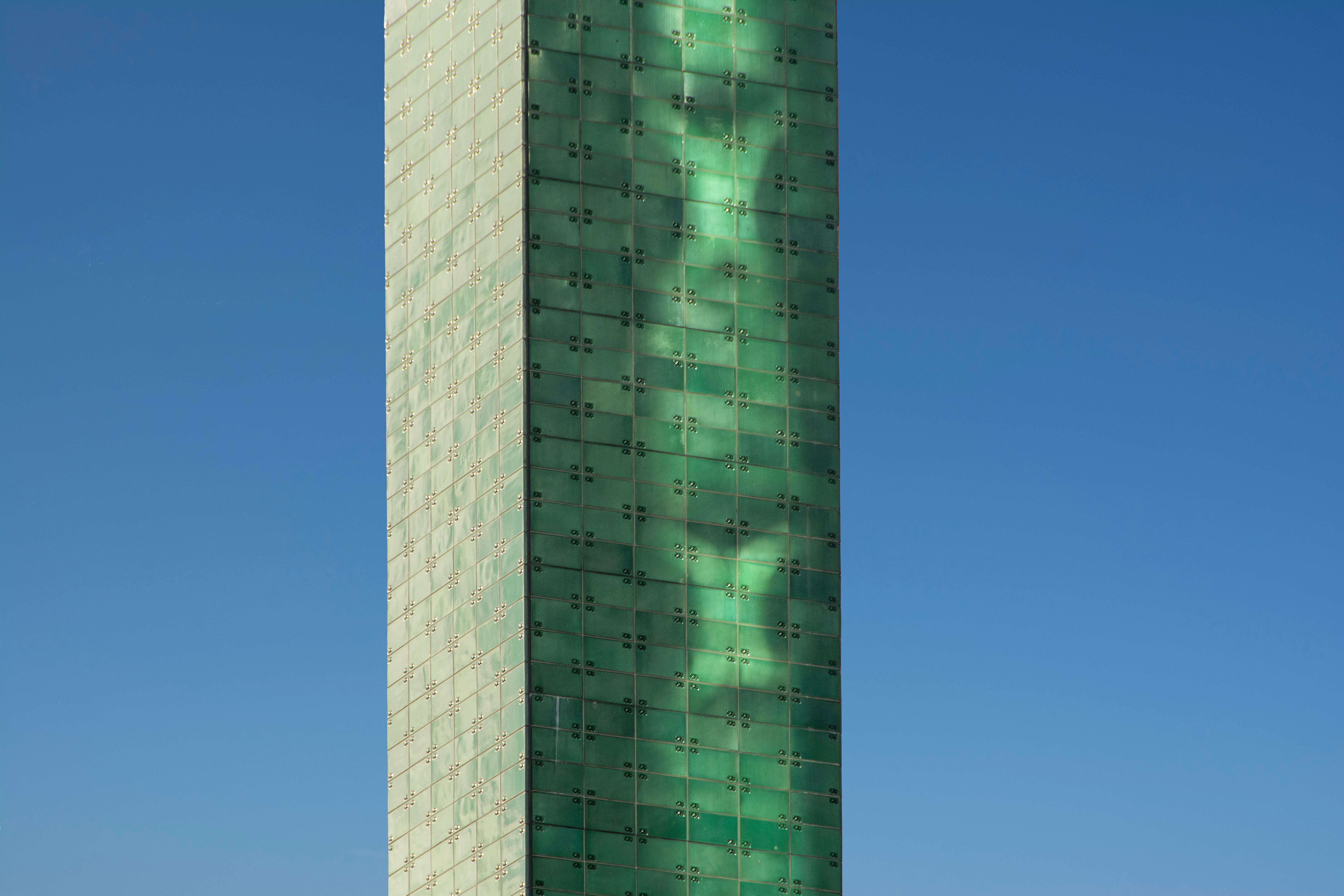Modern Glass Tower Against Blue Sky · Free Stock Photo