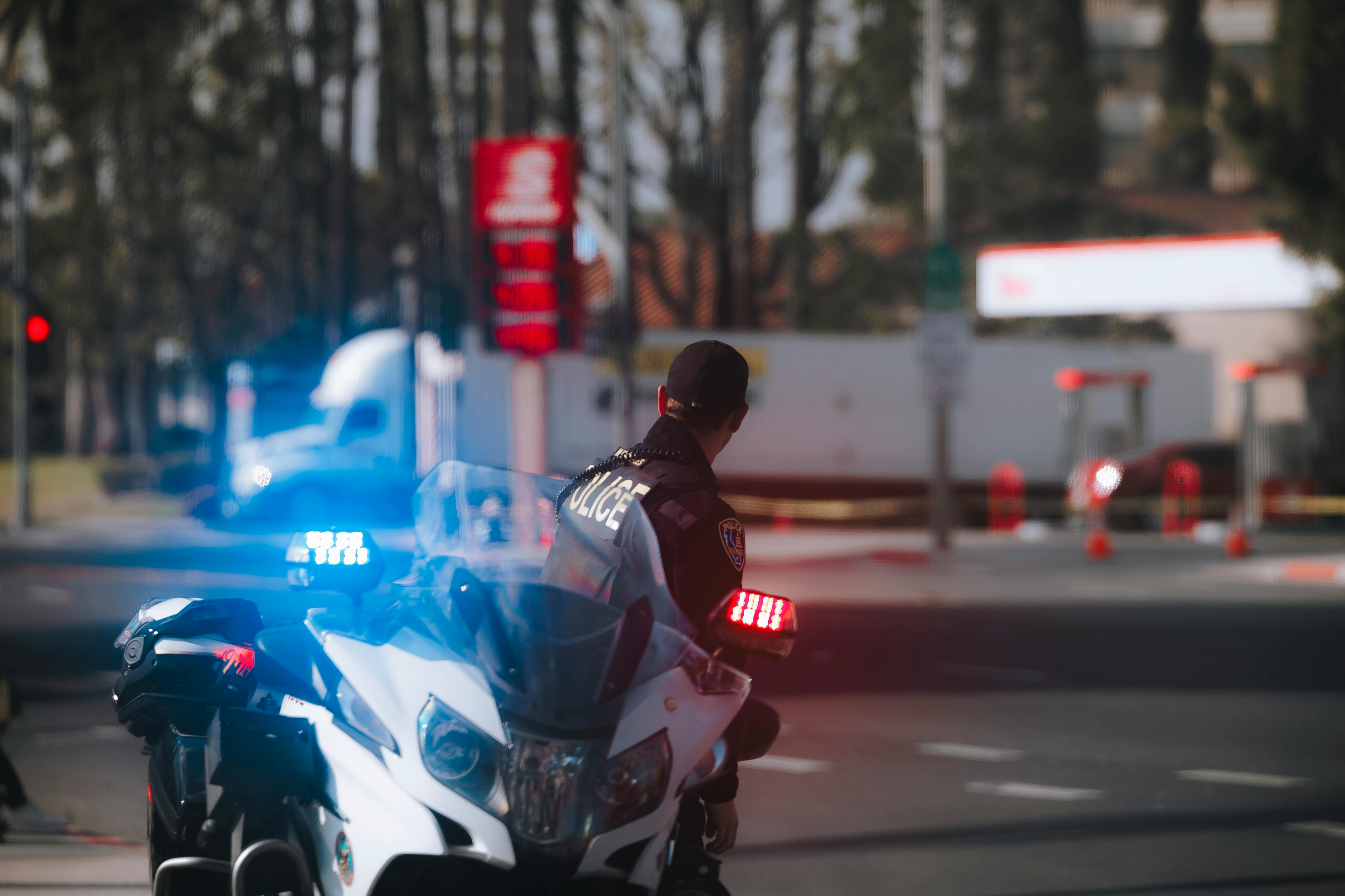 Police Officer on Motorcycle in Urban Setting · Free Stock Photo