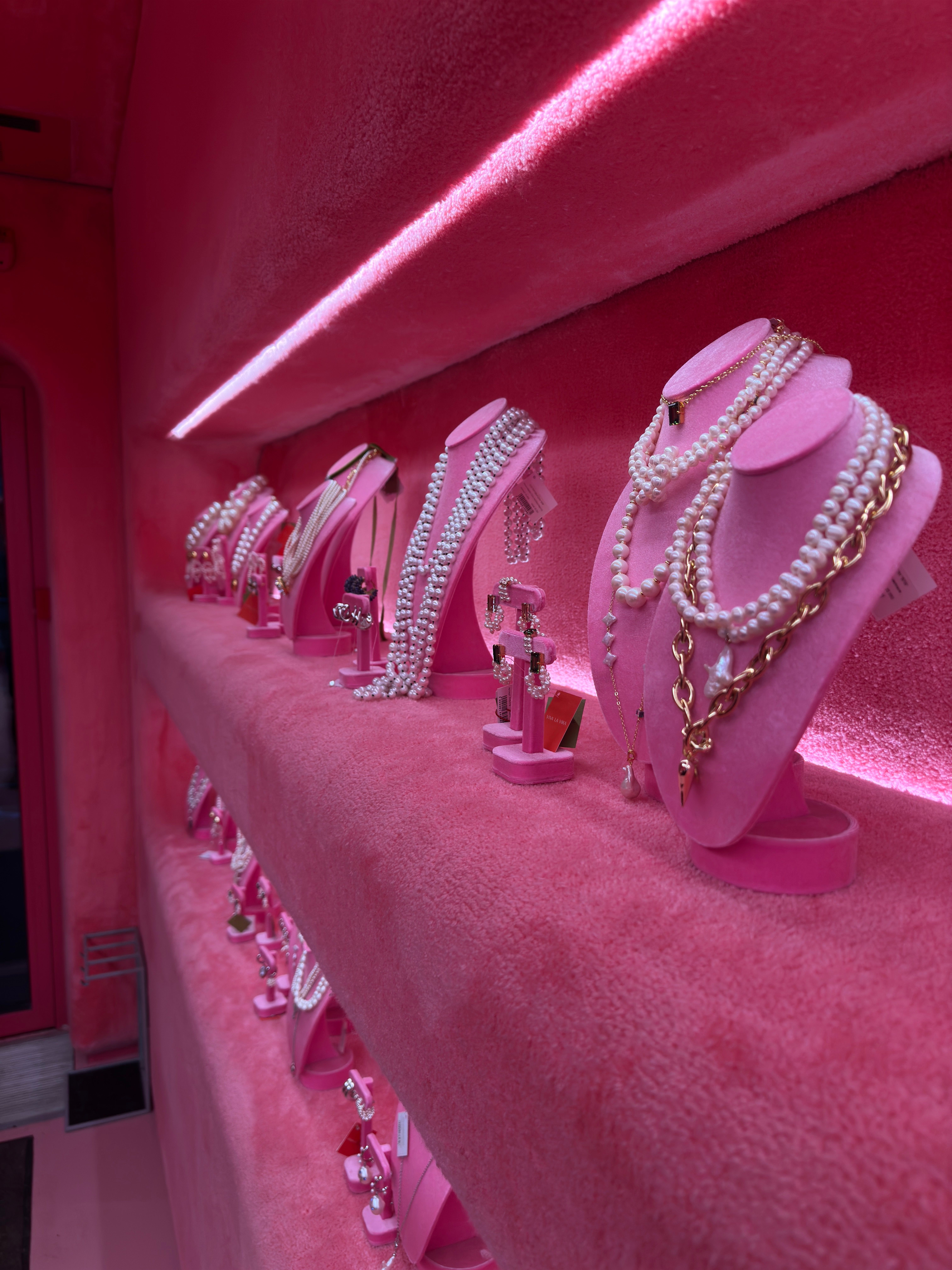 Elegant Jewelry Display with Pink Velvet Backdrop · Free Stock Photo