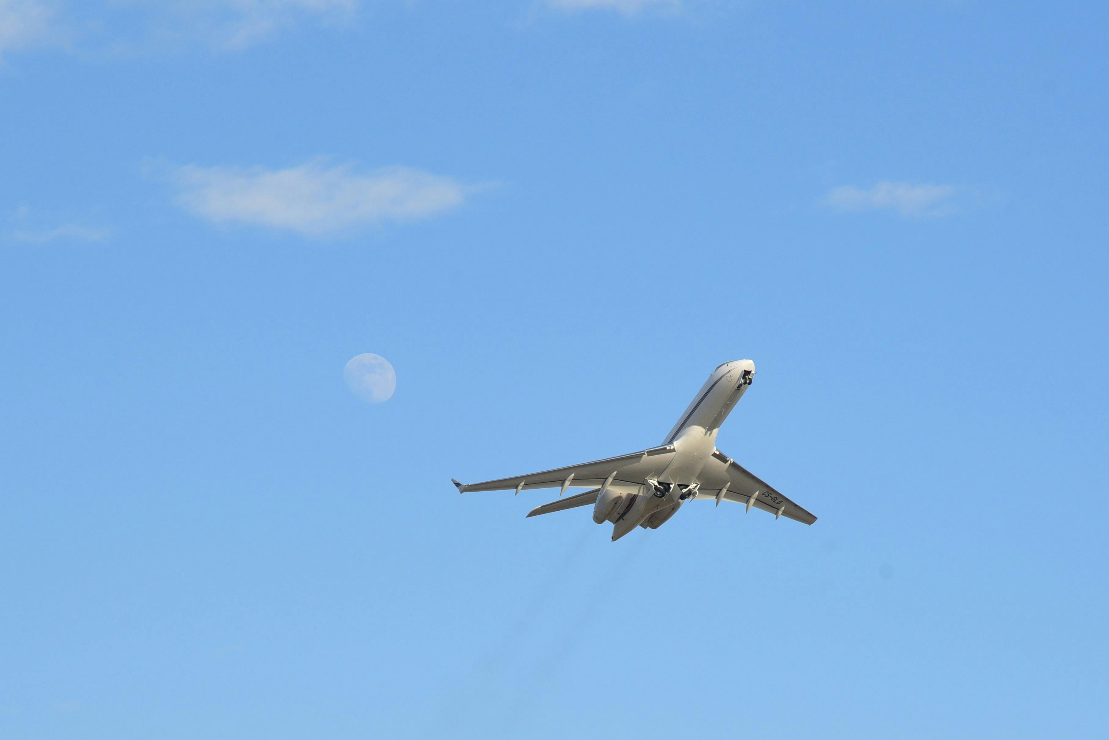 Commercial Jet Taking Off Against Blue Sky · Free Stock Photo