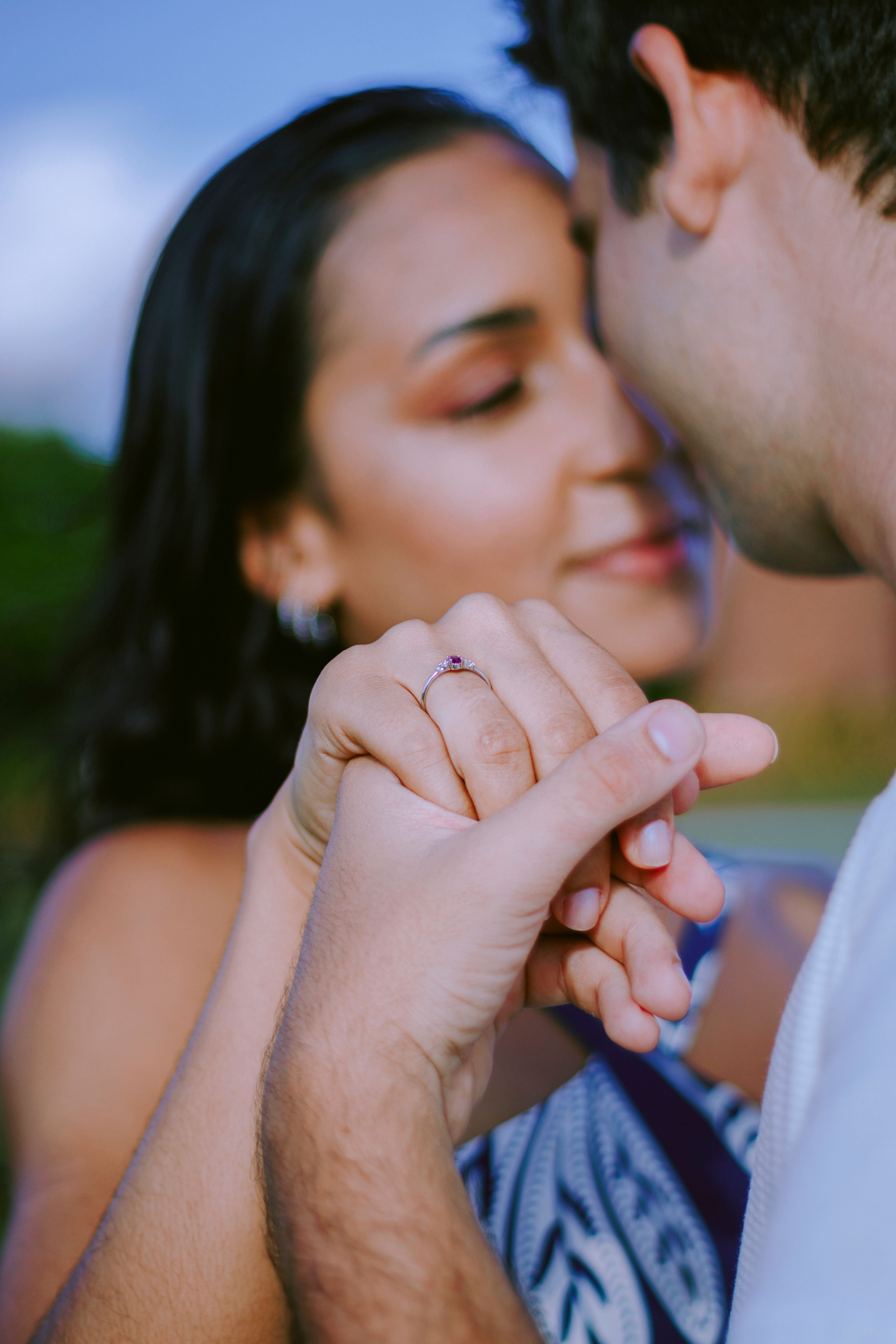 Romantic Couple Holding Hands in Tender Moment · Free Stock Photo