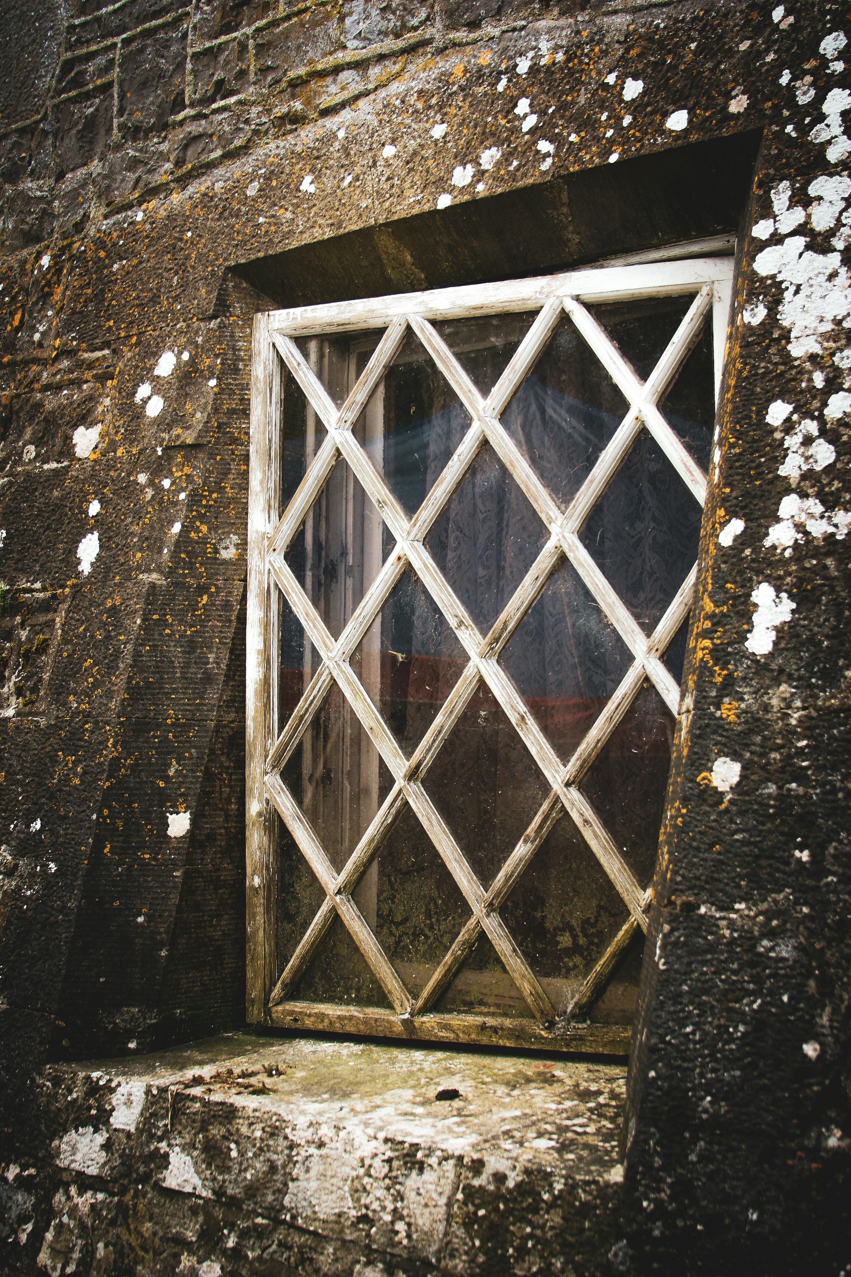 Rustic Stone Castle Window with Lattice Design · Free Stock Photo
