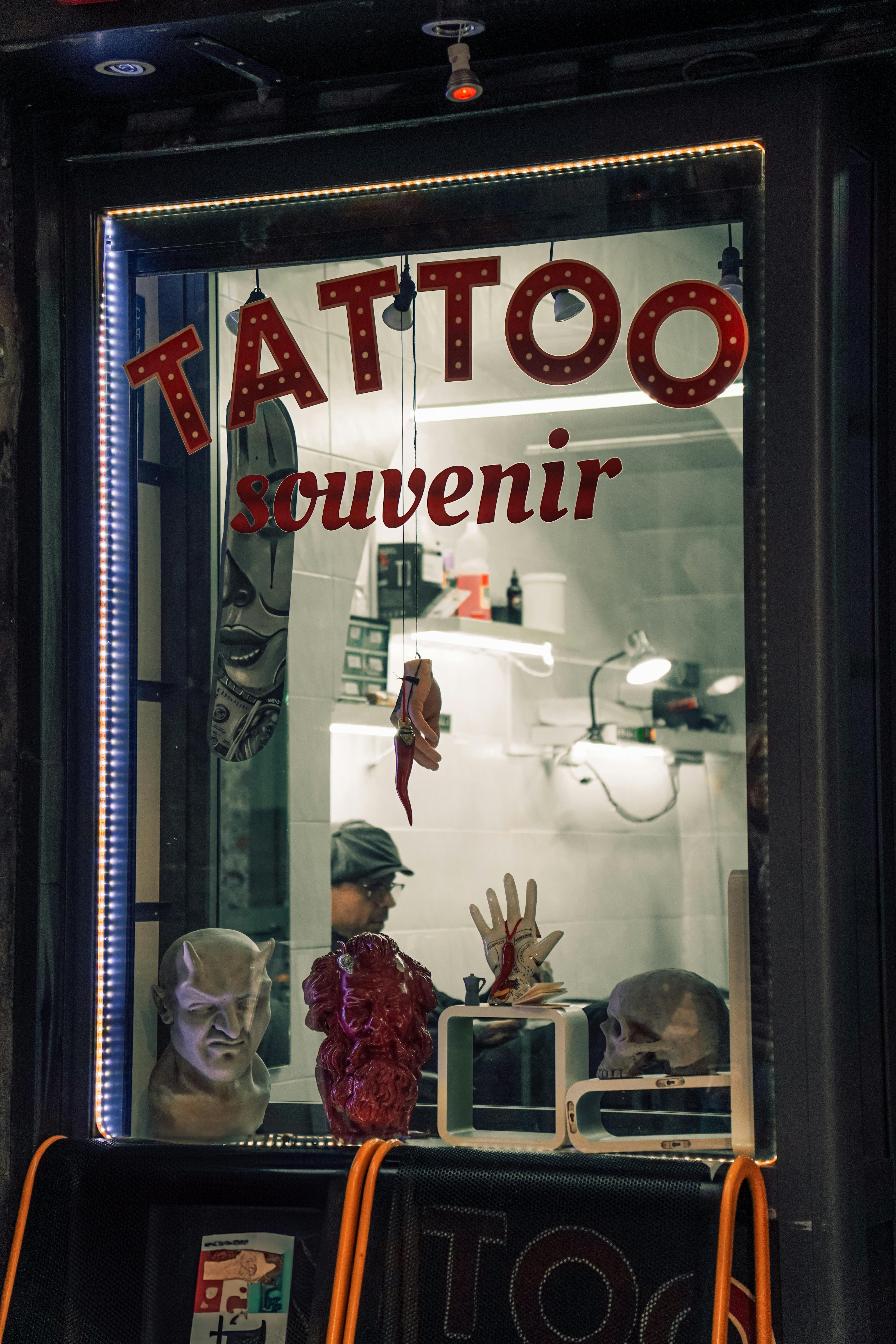 Tattoo Souvenir Shop Window Display in Naples · Free Stock Photo