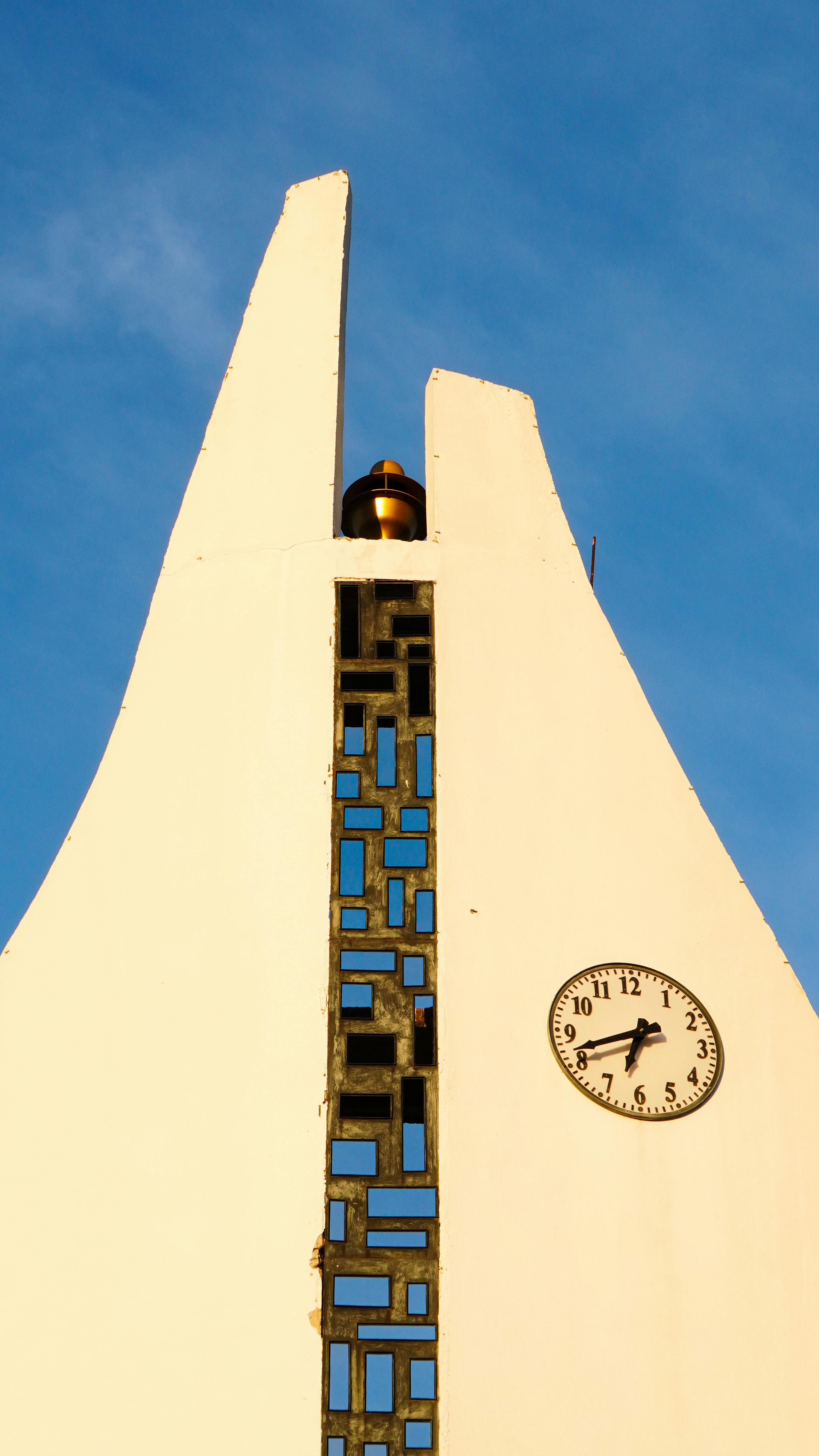 Modern Clock Tower Against Blue Sky in El Salvador · Free Stock Photo