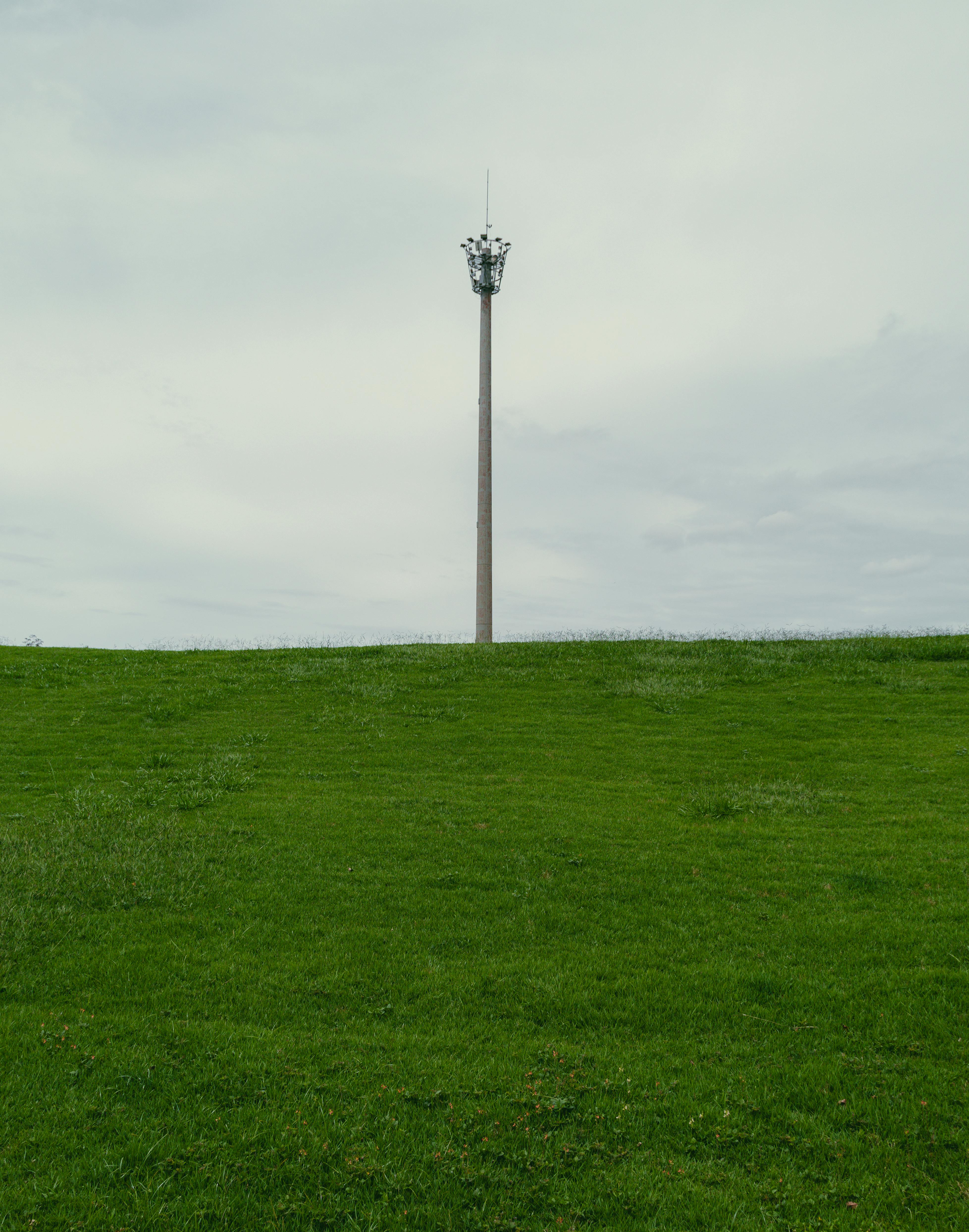Lonely Antenna Tower in Green Field Landscape · Free Stock Photo