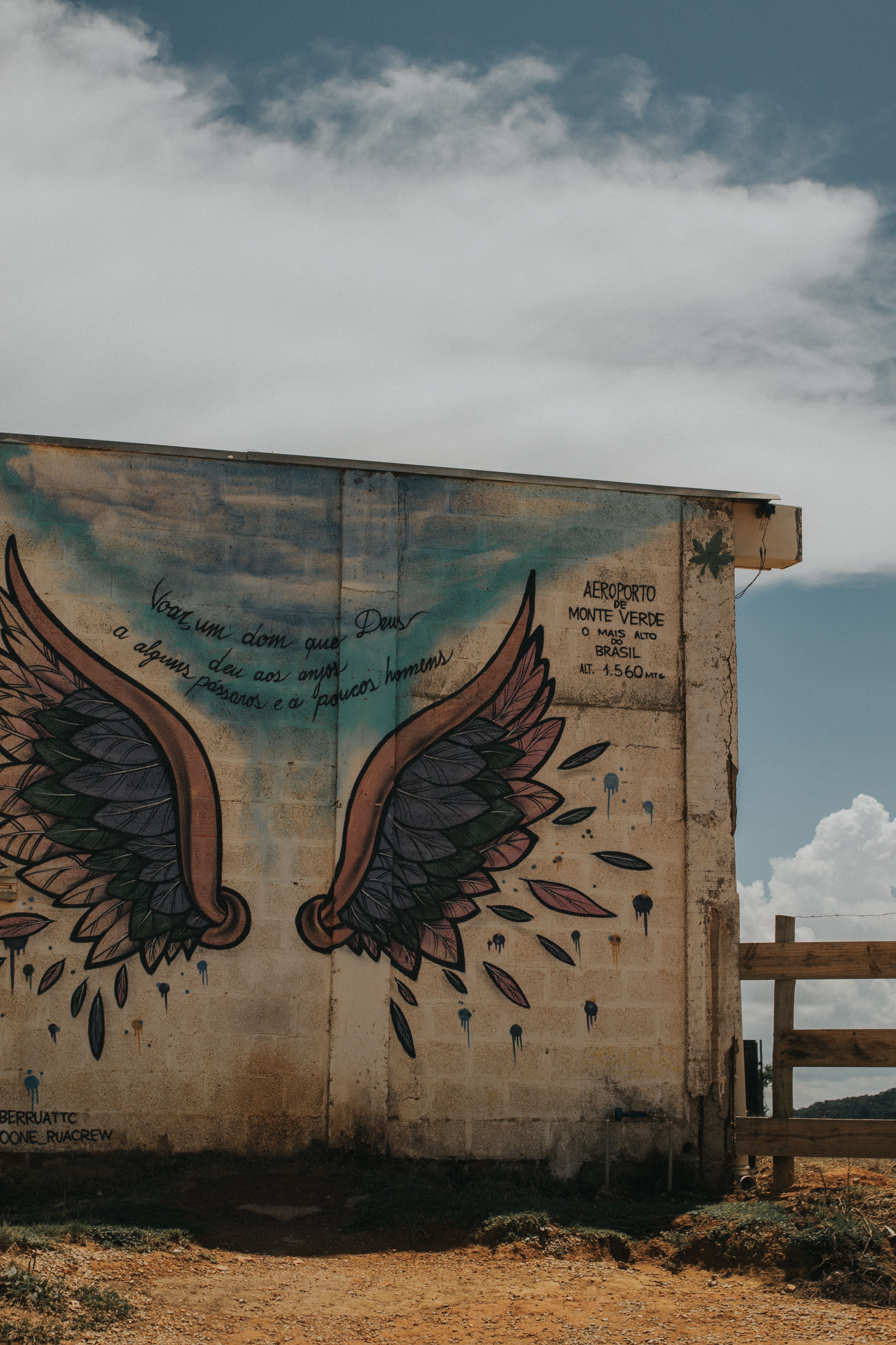 Street Art Mural on Rustic Cement Wall Outdoors · Free Stock Photo