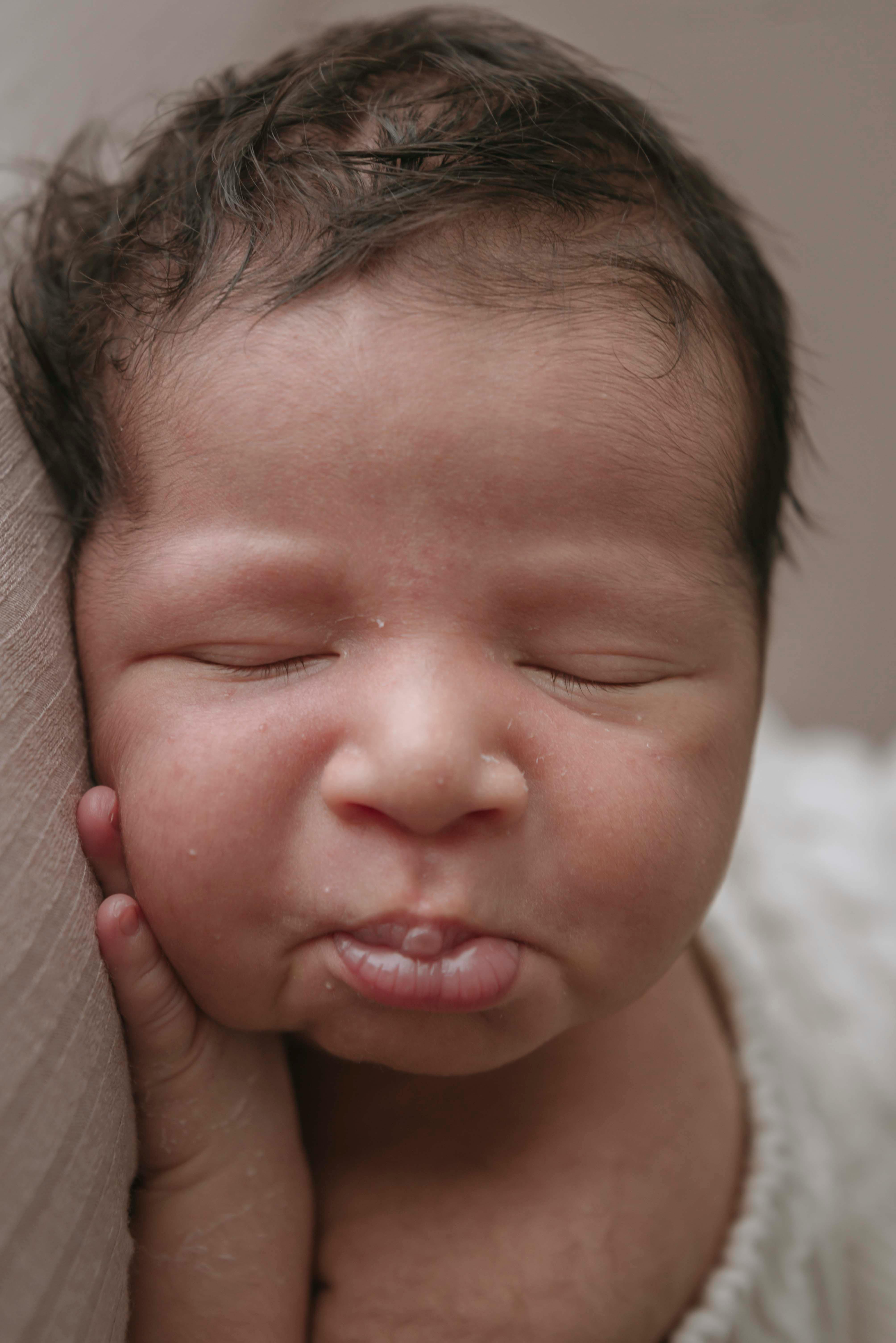 Peaceful Sleeping Newborn with Pouty Lips · Free Stock Photo