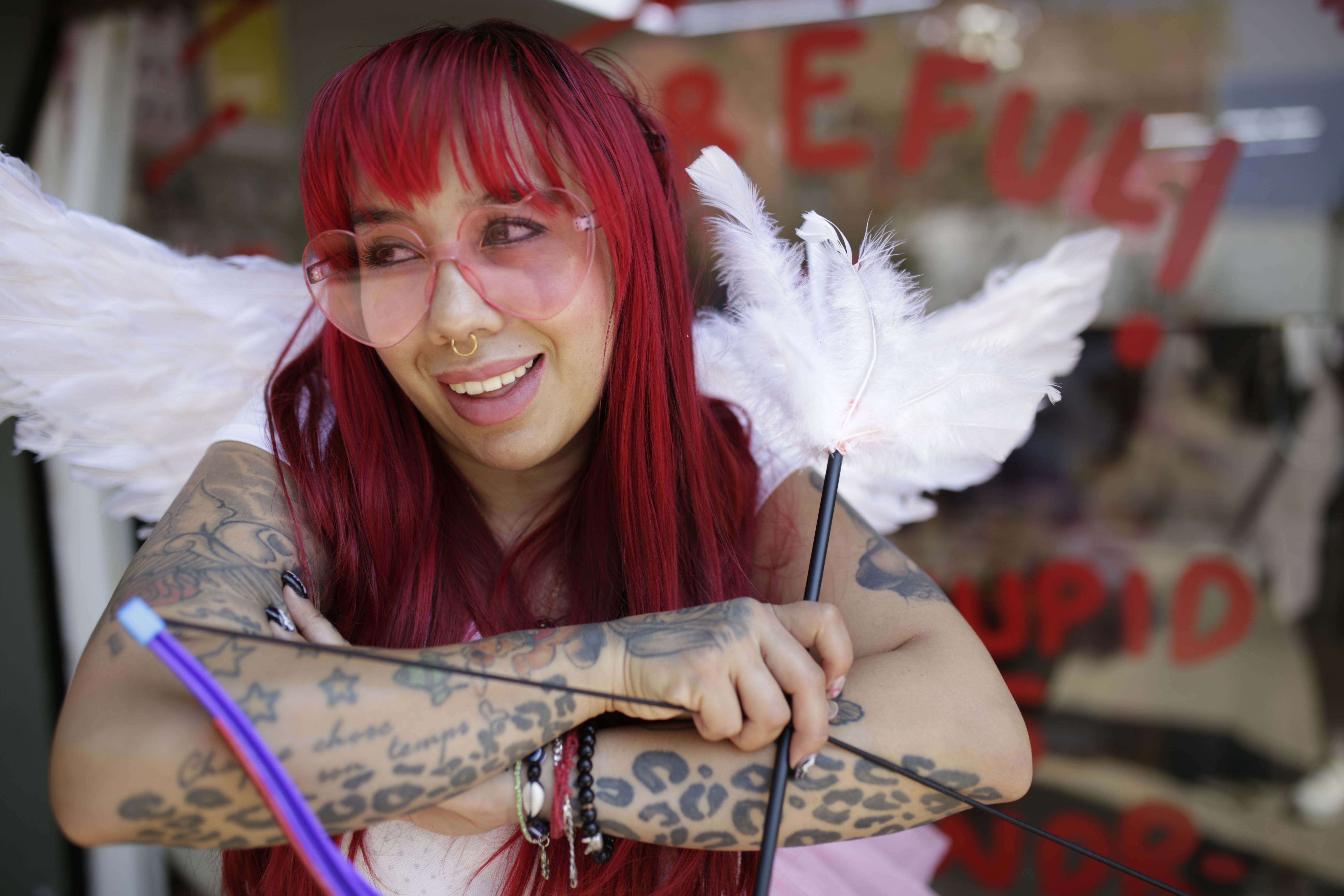 Playful Cupid Themed Portrait in Urban Setting · Free Stock Photo