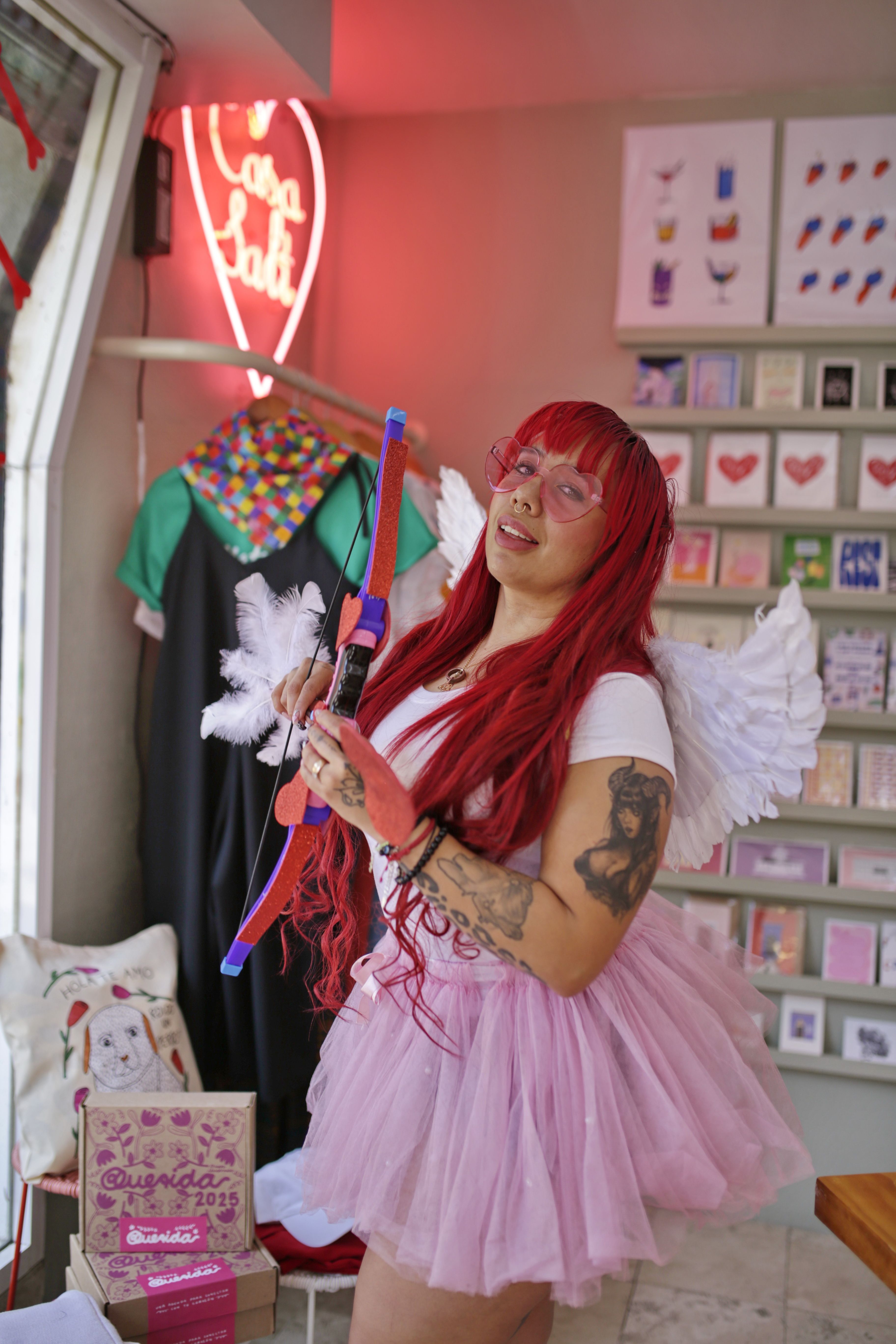 Creative Cupid-Themed Portrait in Mexico City Shop · Free Stock Photo