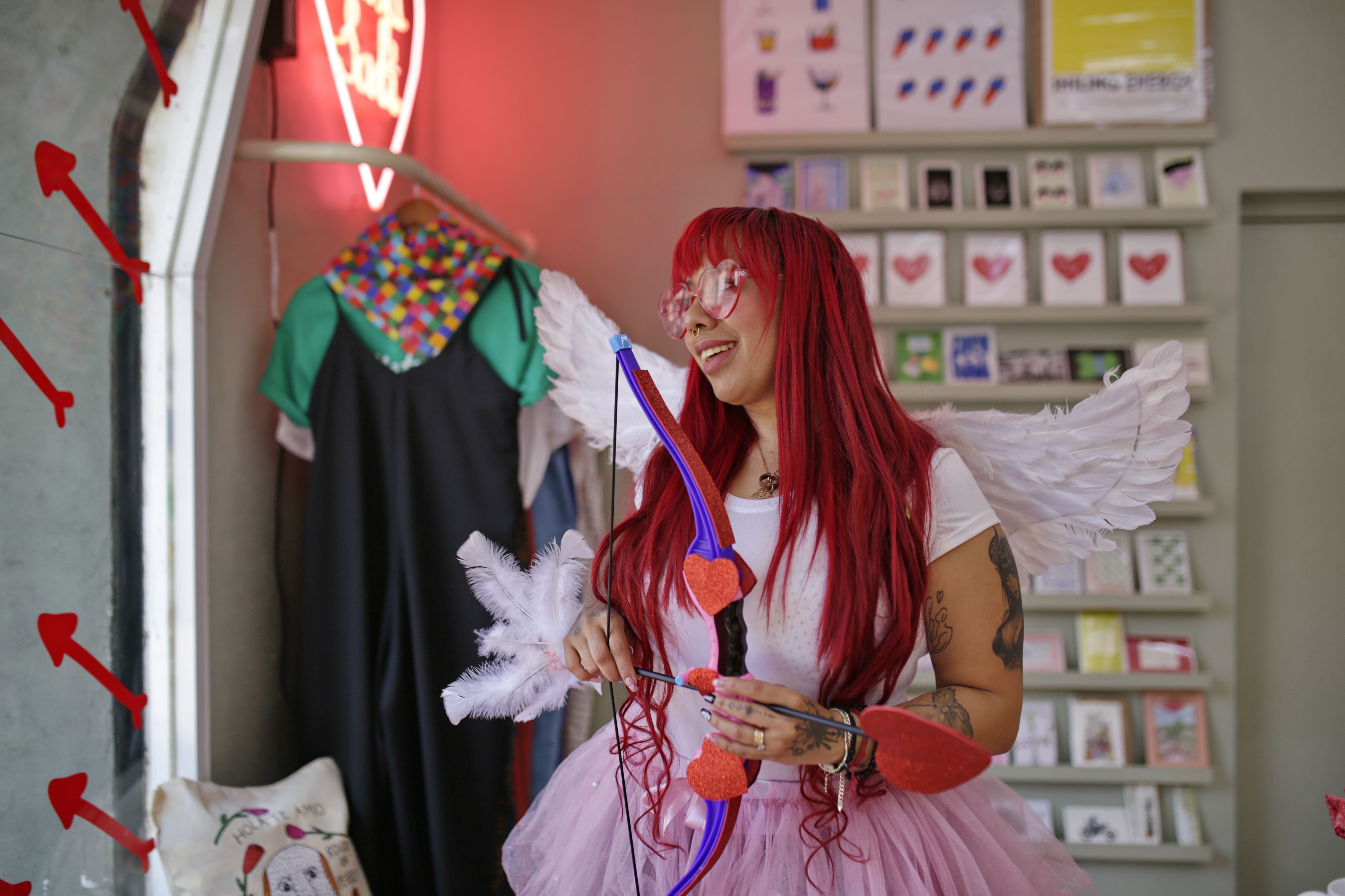 Playful Cupid Costume in Vibrant Urban Store · Free Stock Photo