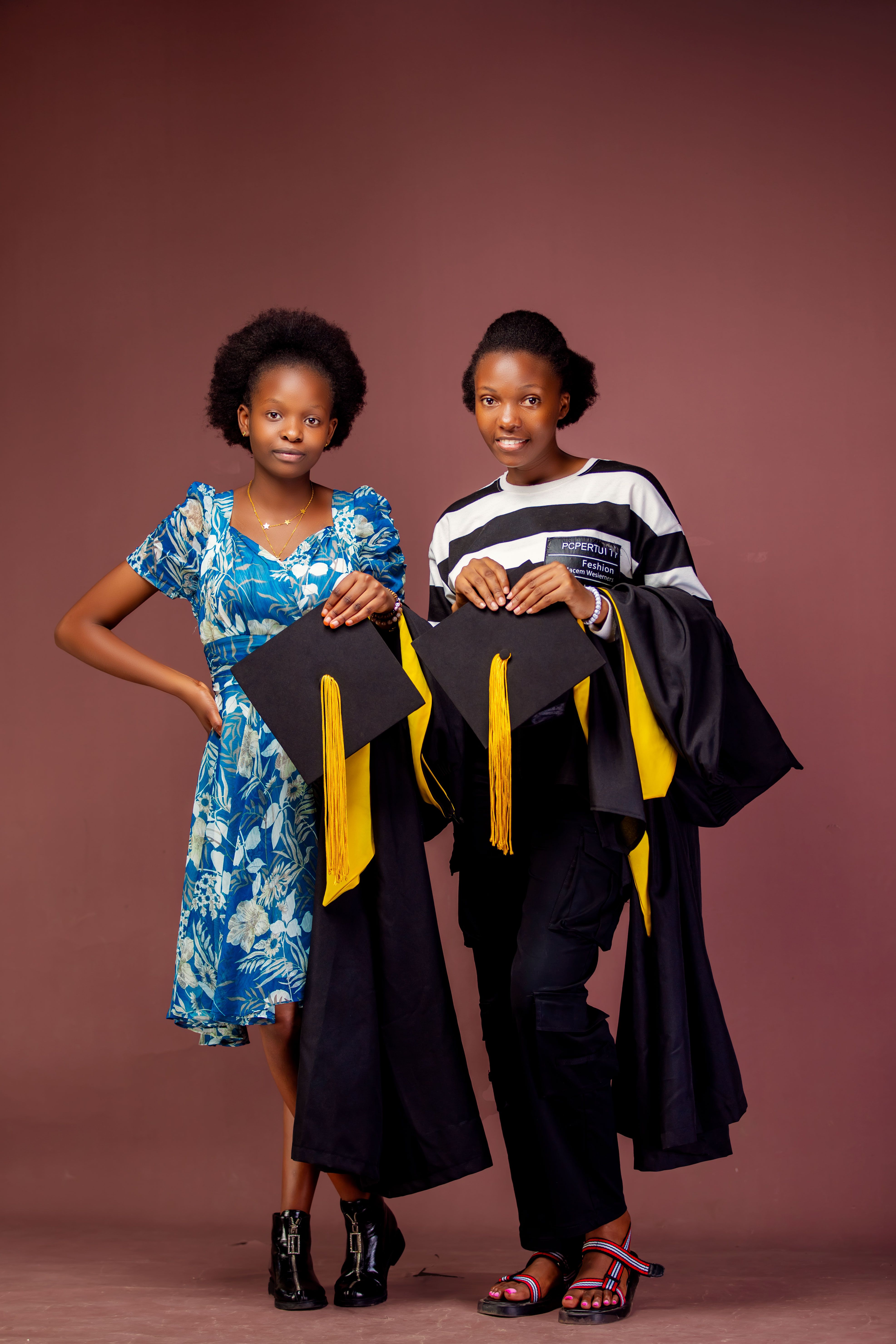 Two Smiling Women Celebrating Graduation Success · Free Stock Photo