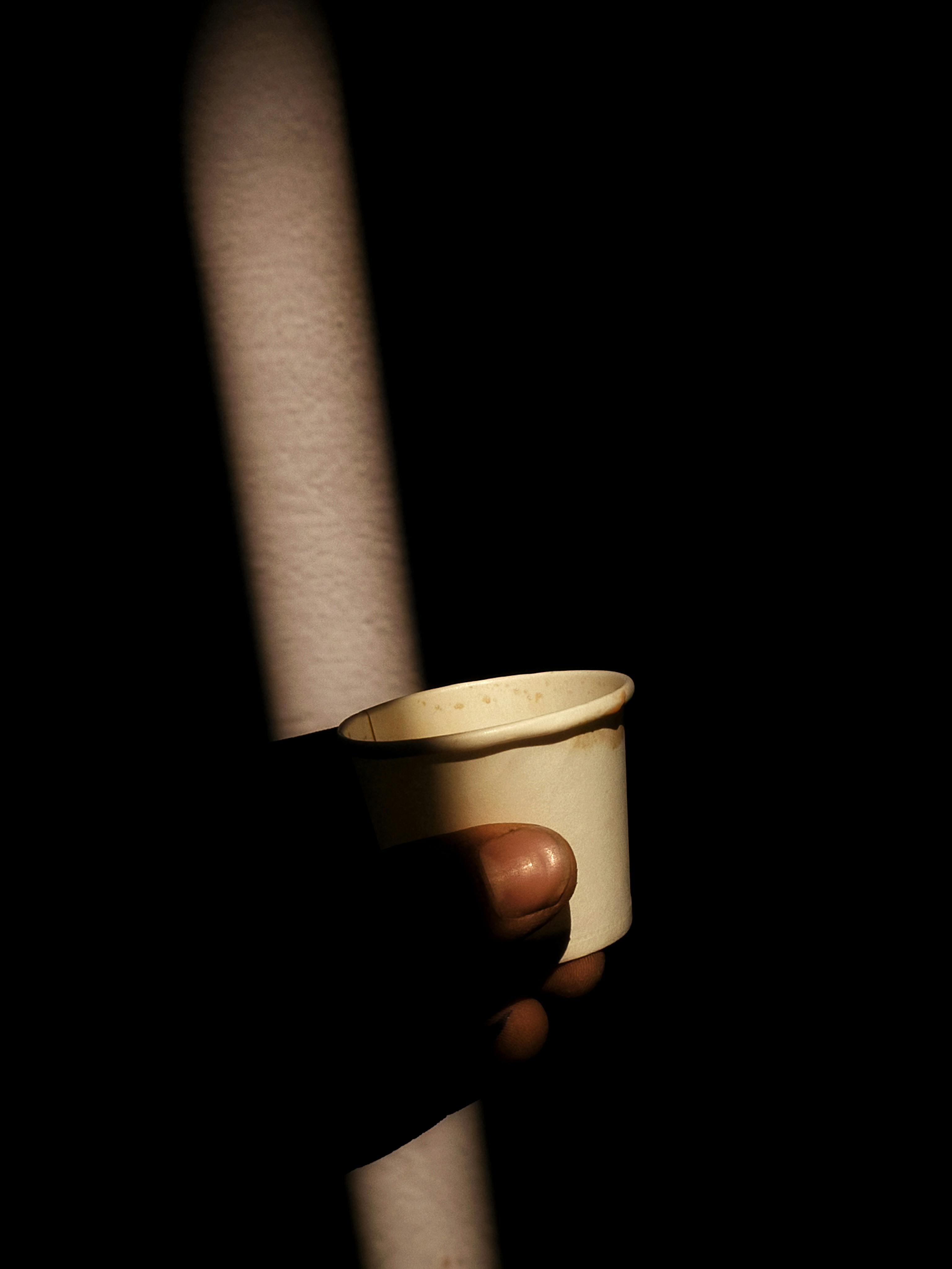 Minimalist Coffee Cup with Dramatic Shadows · Free Stock Photo