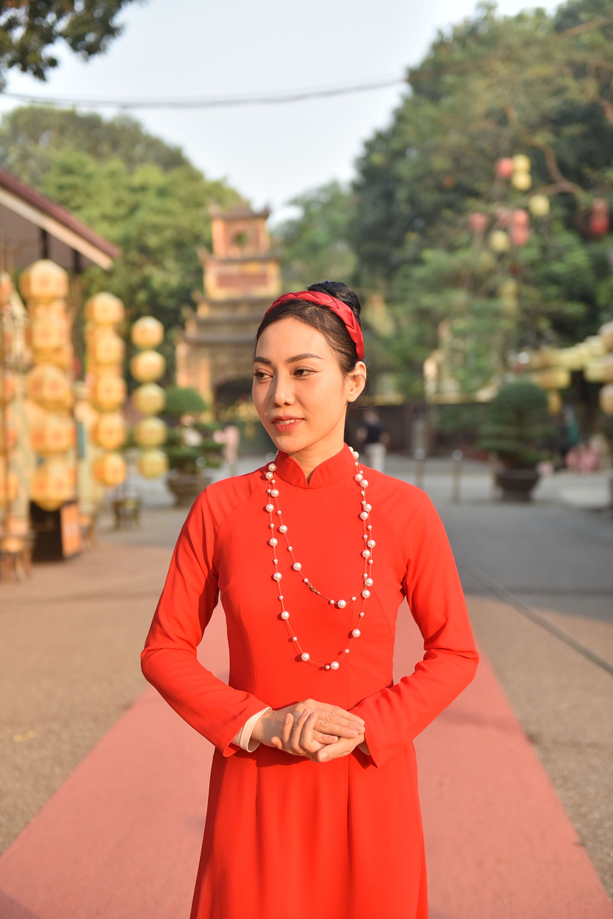 Woman in Red Traditional Vietnamese Dress Outdoors · Free Stock Photo