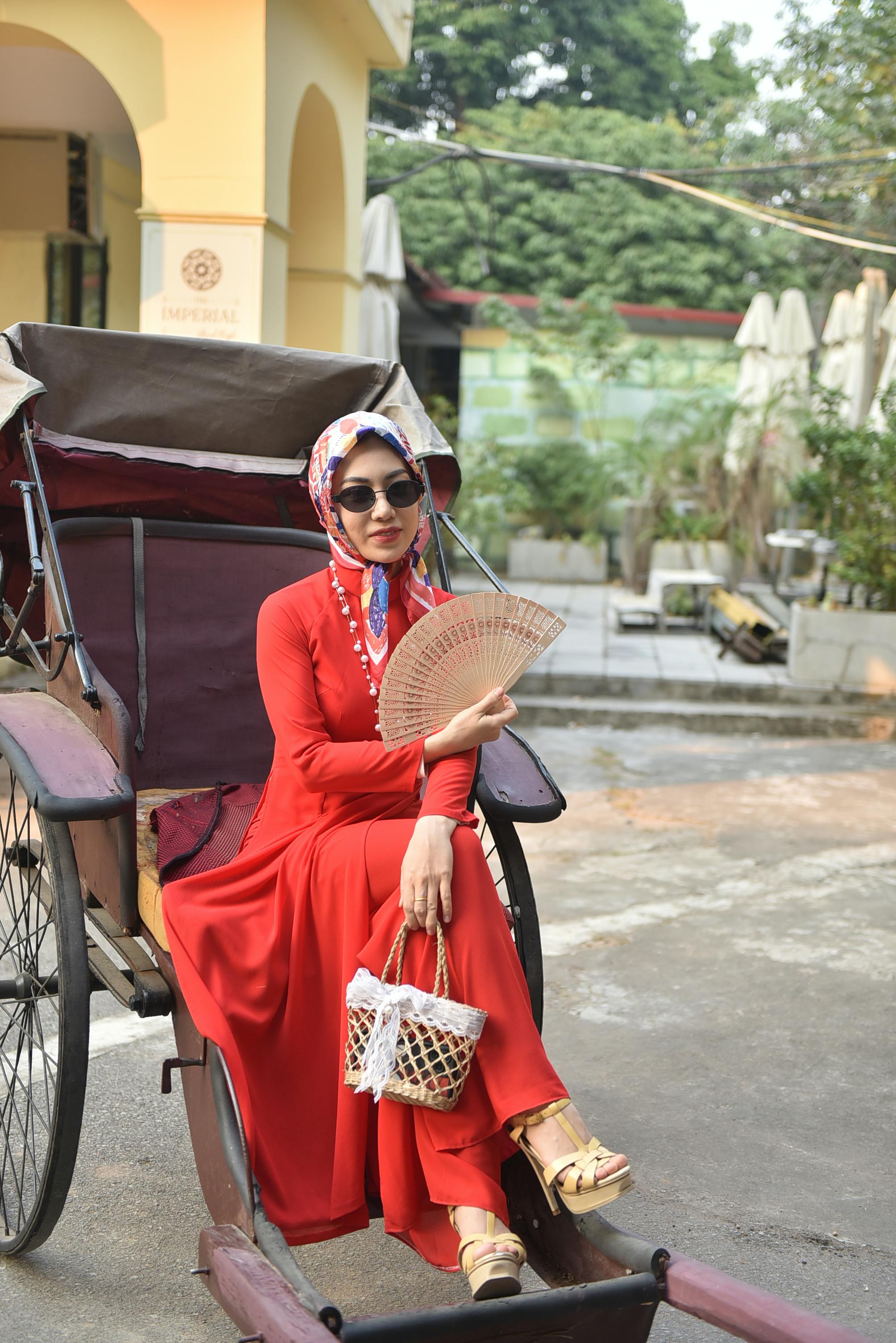 Stylish Woman in Red Dress Sitting on Vintage Rickshaw · Free Stock Photo