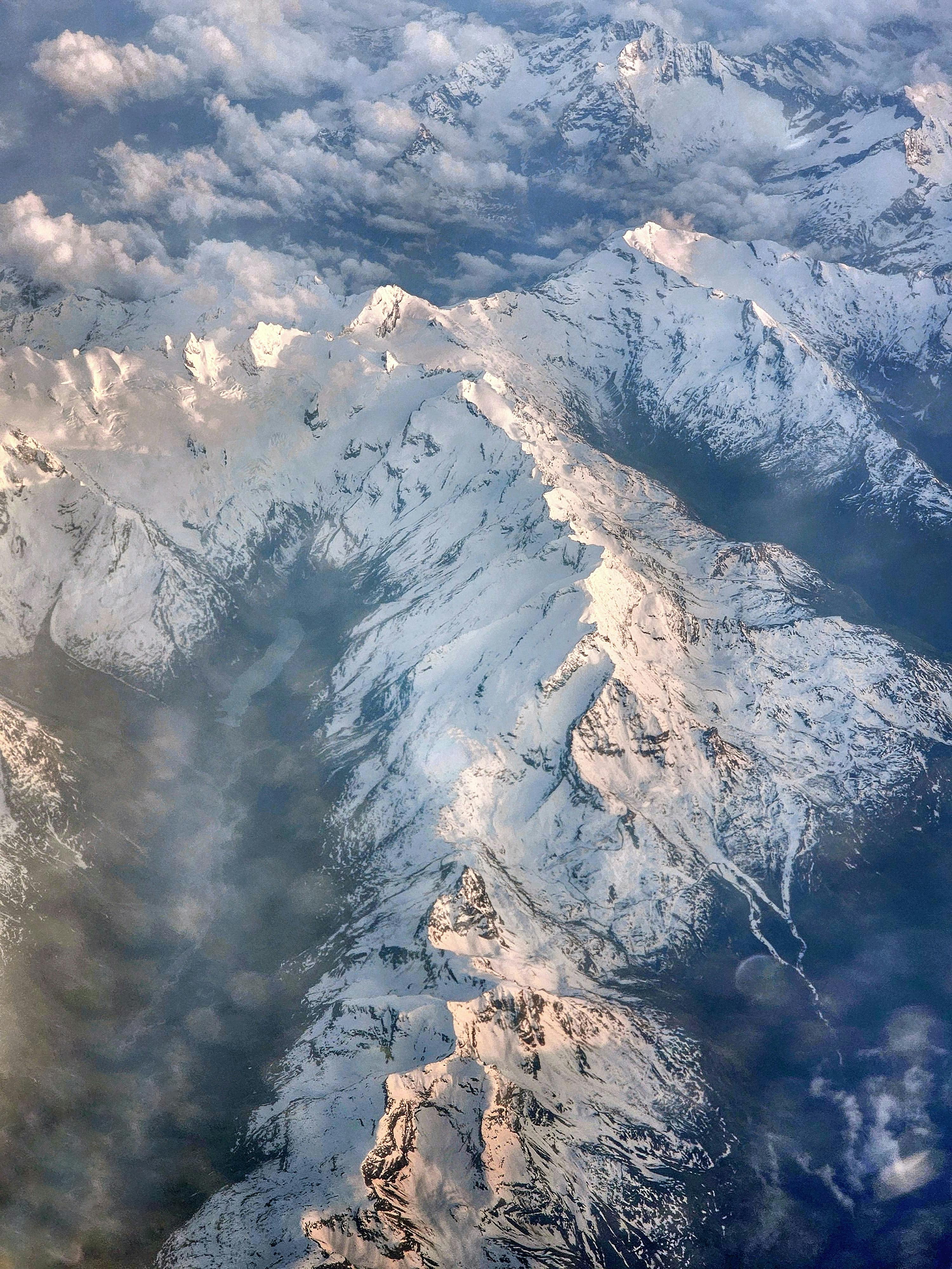 Aerial View of Snow-Capped Swiss Alps Peaks · Free Stock Photo