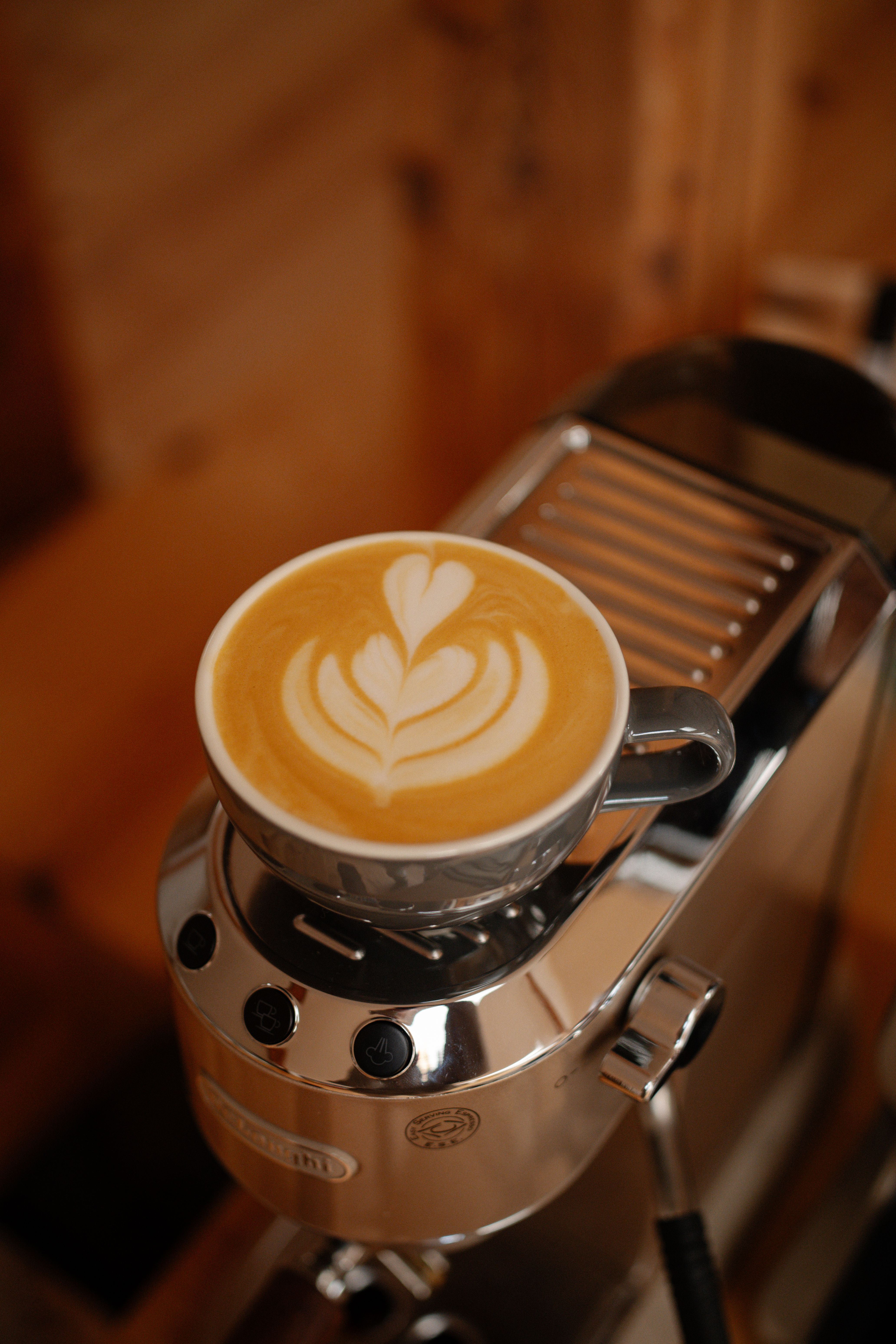 Elegant Latte Art in a Modern Coffee Machine · Free Stock Photo