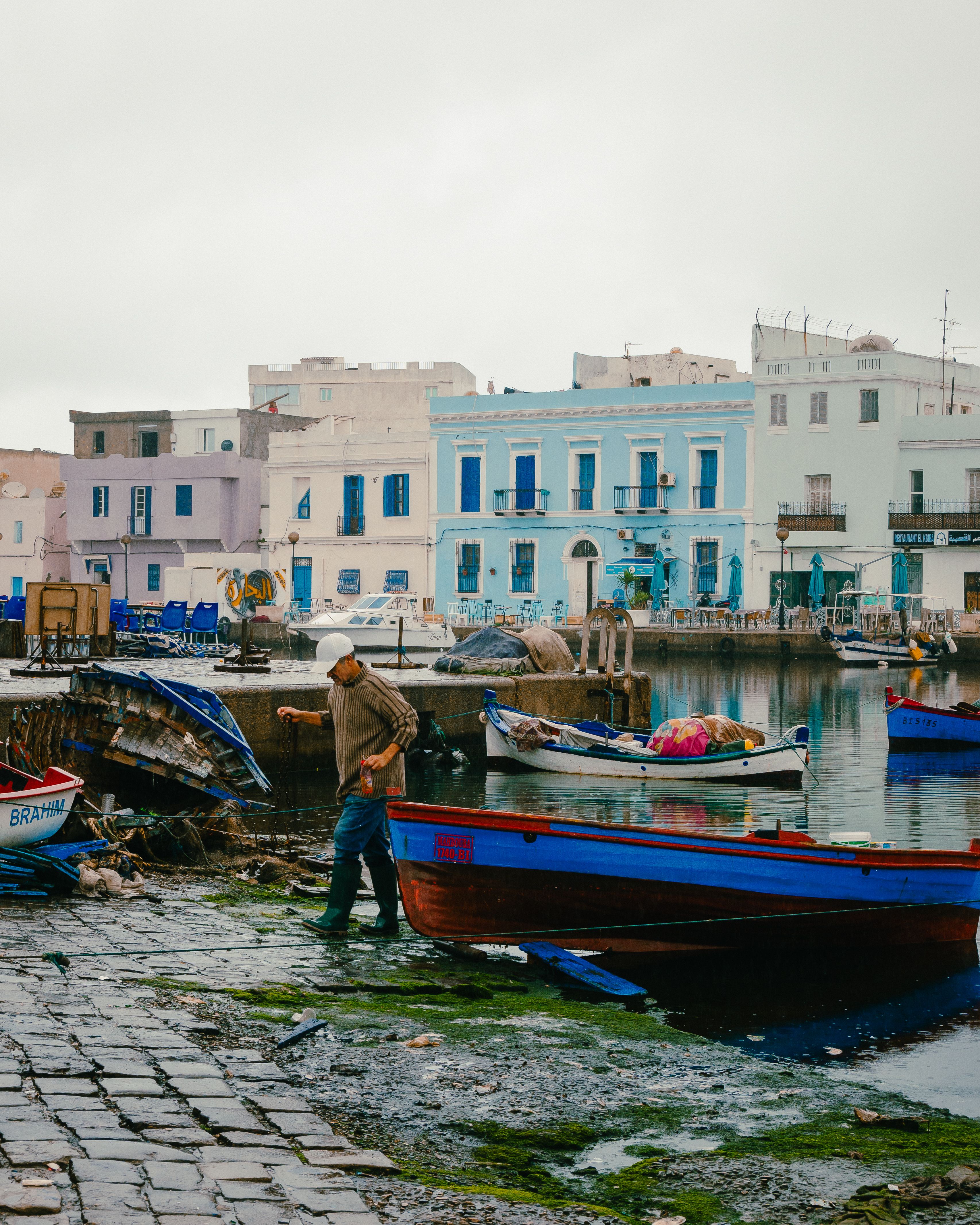 Quaint Harbor Scene with Boats and Buildings · Free Stock Photo