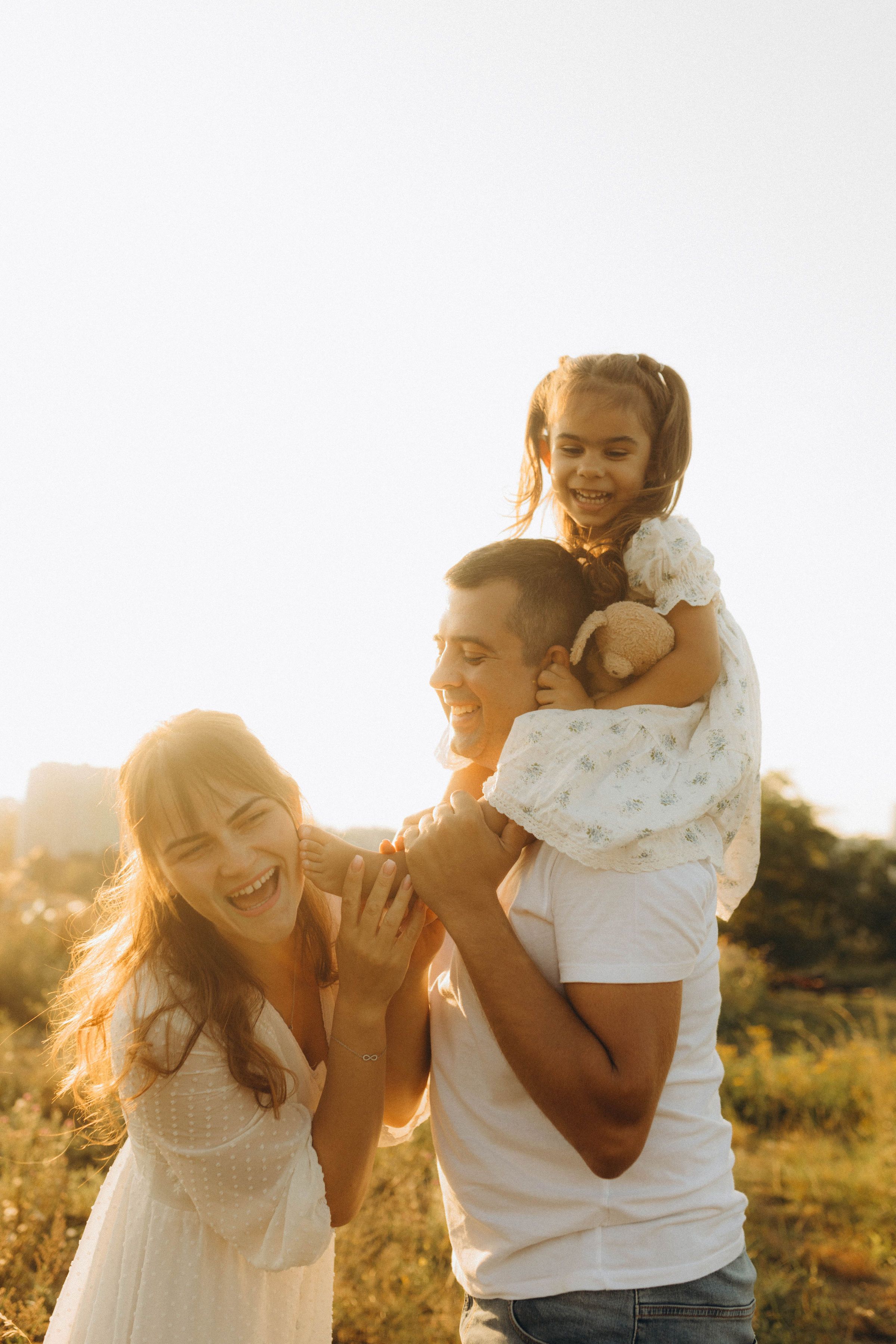 Happy Family Enjoying Sunny Day Outdoors · Free Stock Photo