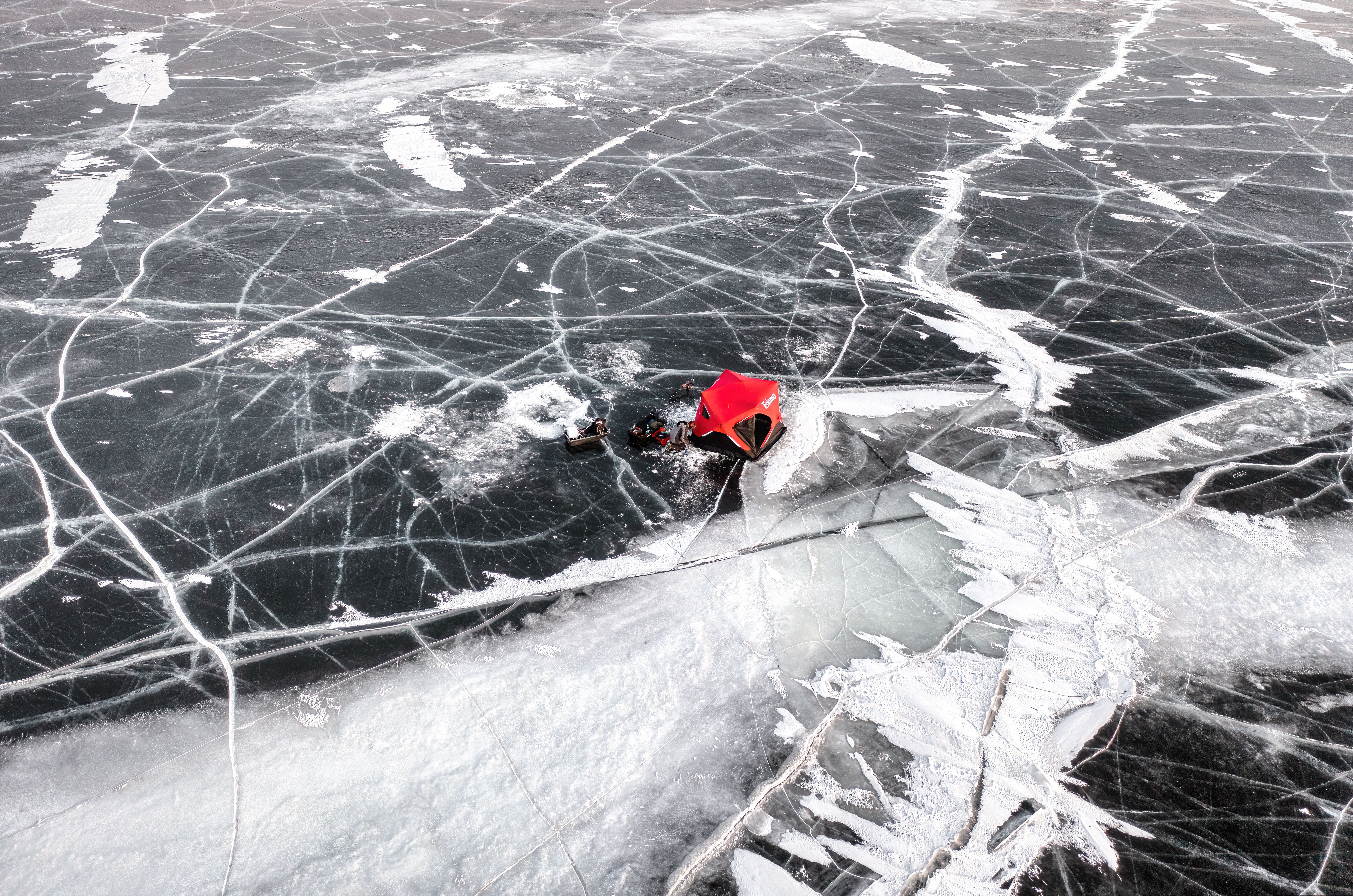 Aerial View of Ice Fishing on a Frozen Lake · Free Stock Photo