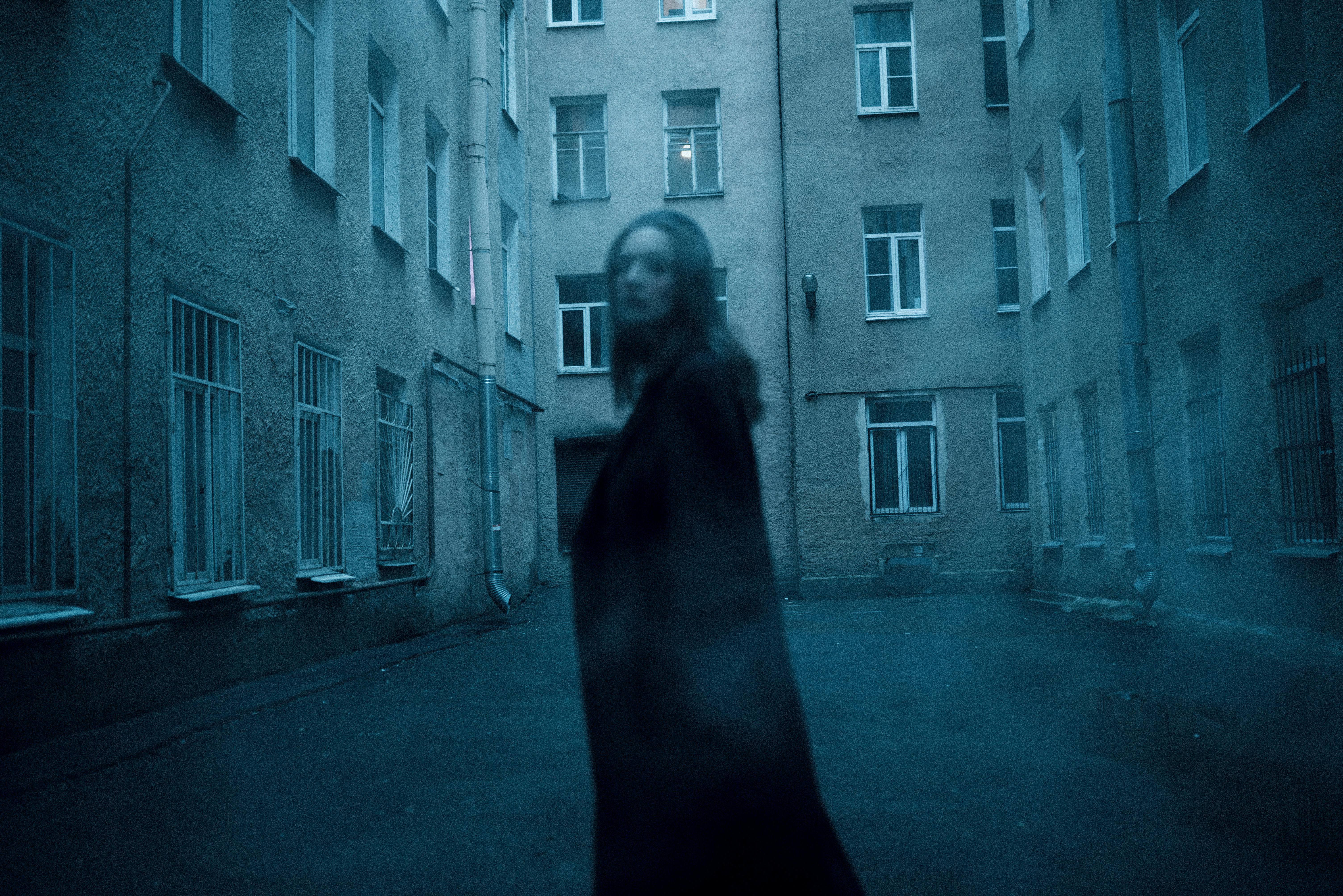 Mystical Urban Scene with Blurred Figure · Free Stock Photo