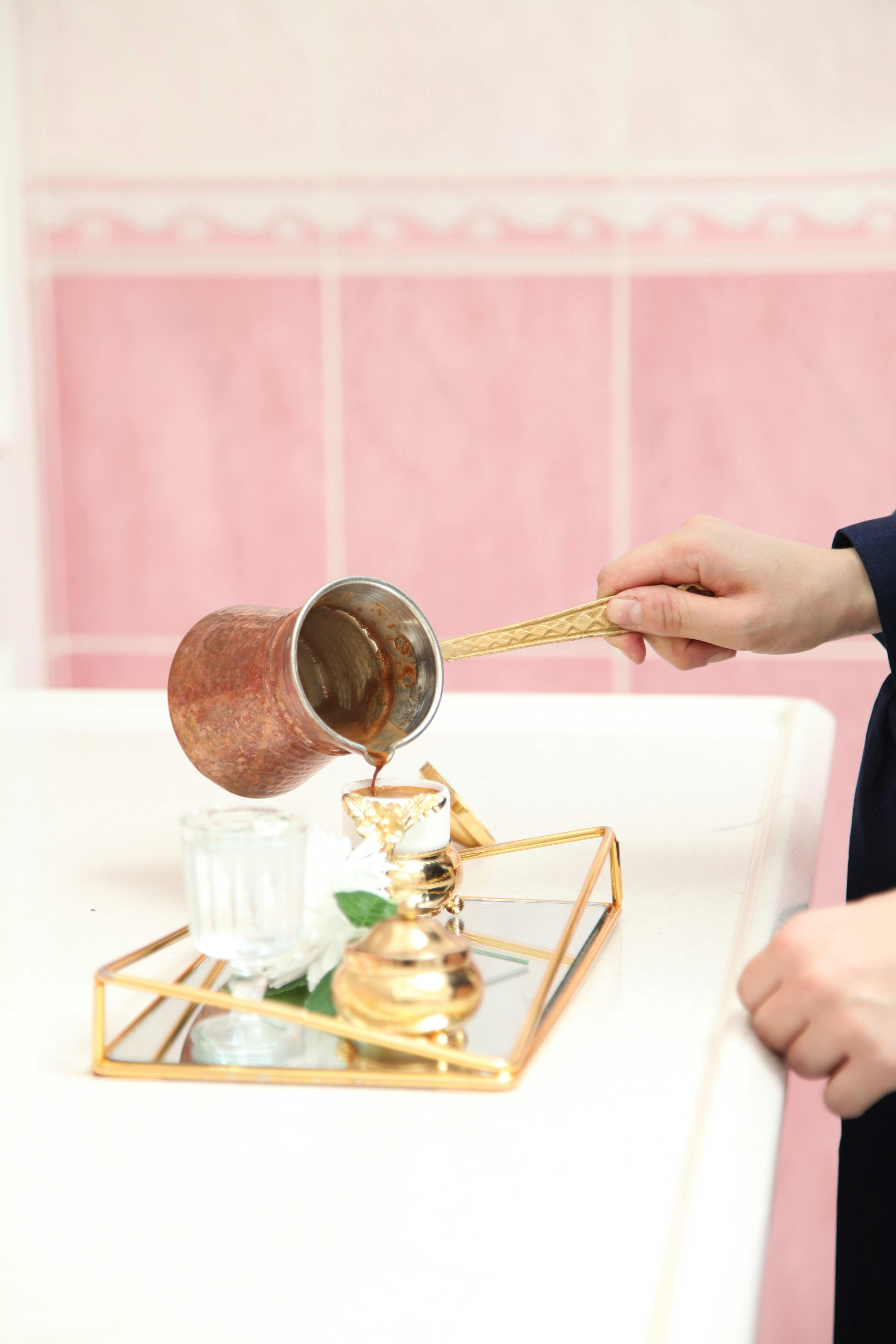 Pouring Traditional Turkish Coffee in Elegant Setting · Free Stock Photo