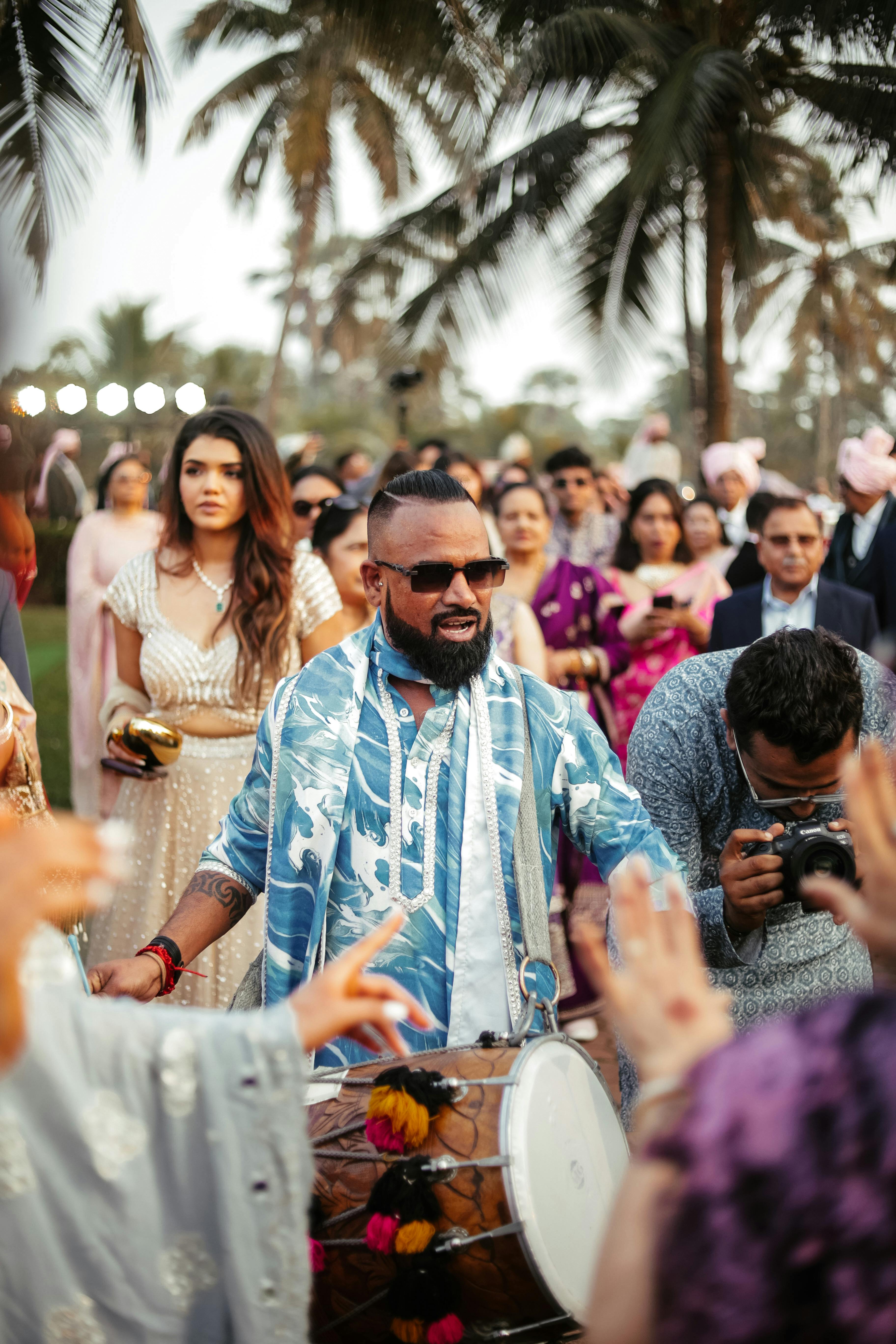 Vibrant Indian Wedding Celebration with Drummer · Free Stock Photo