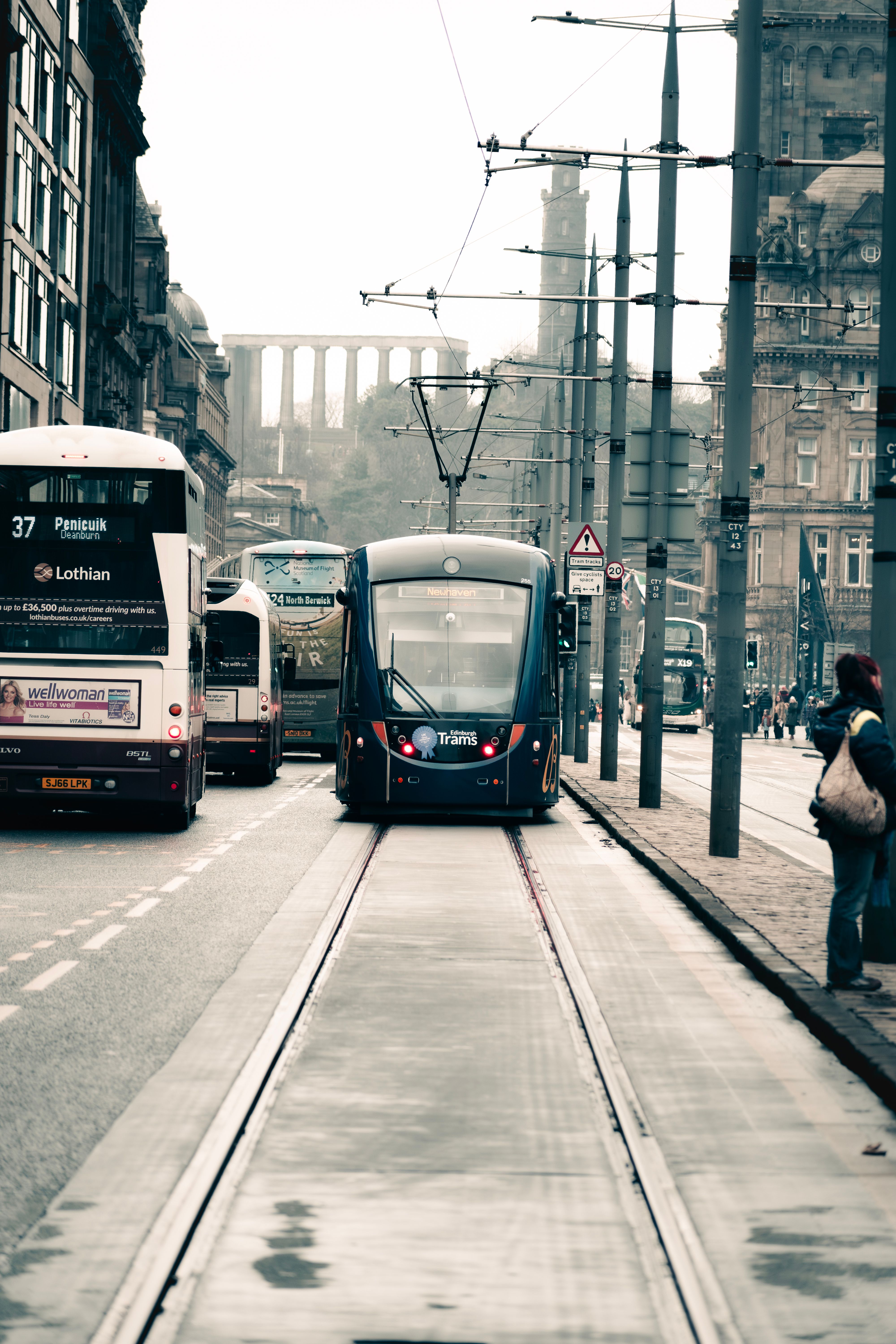 Edinburgh City Street with Tram and Calton Hill View · Free Stock Photo