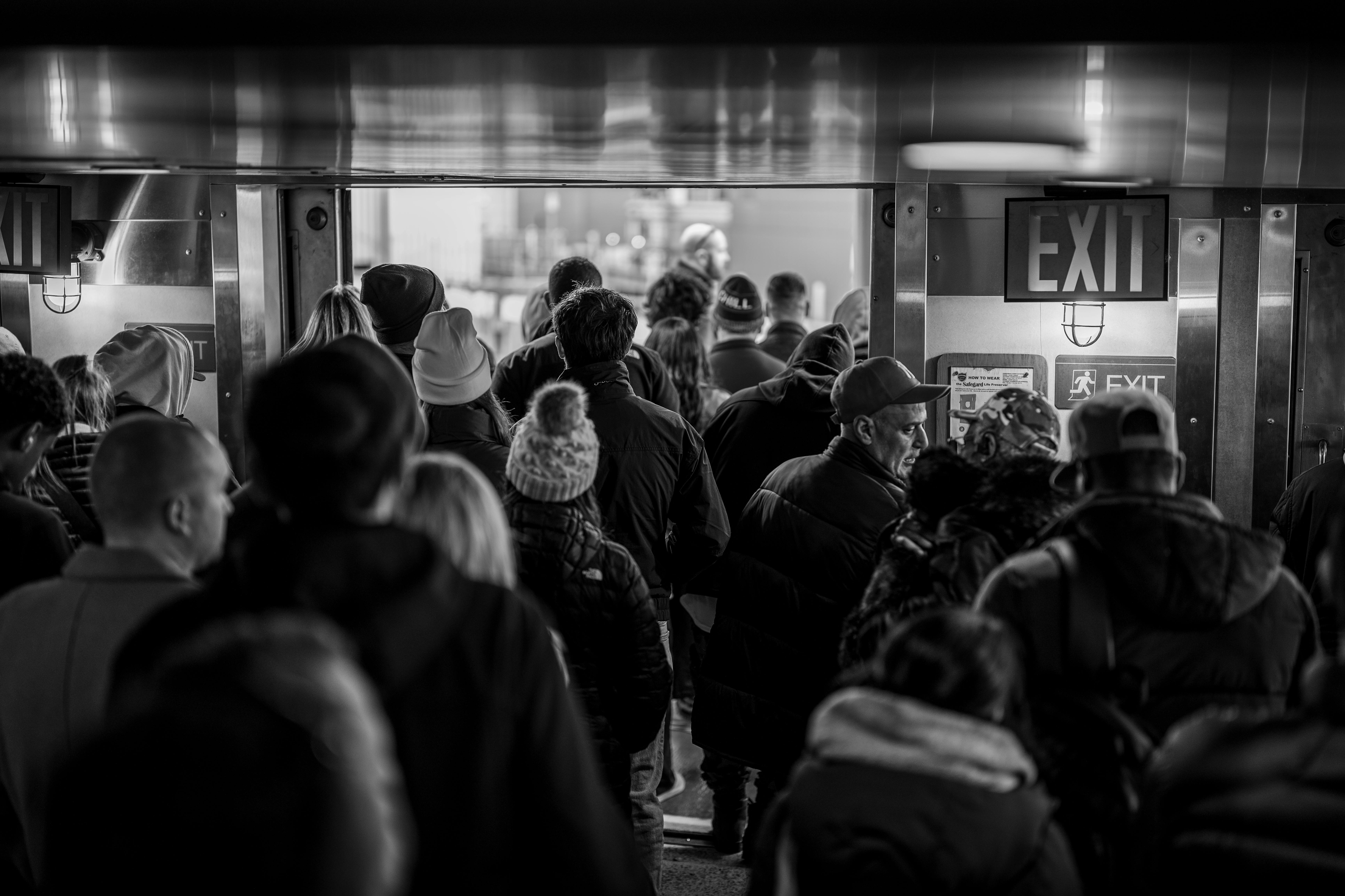 Black and White Crowd Exiting New York Ferry · Free Stock Photo