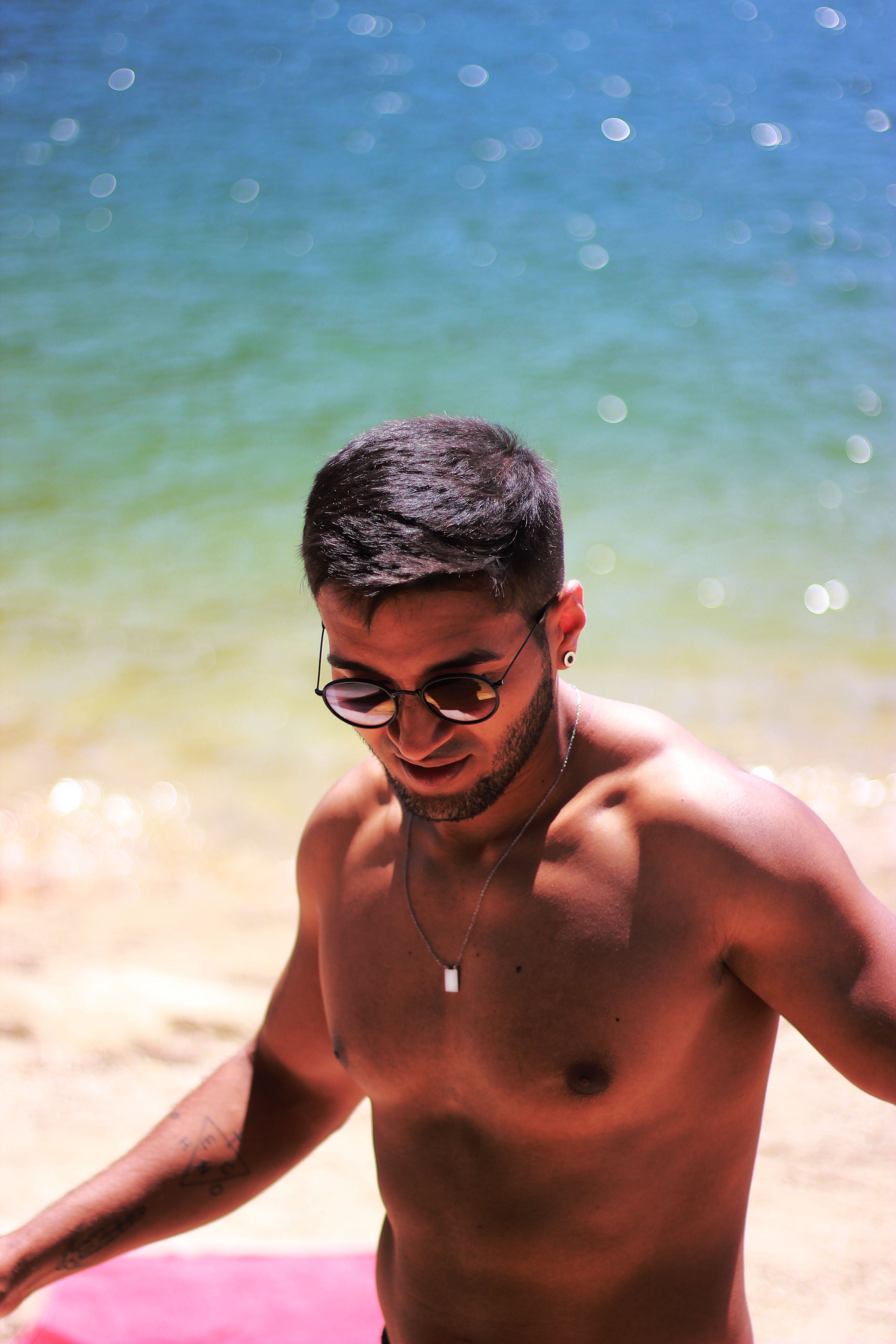 Young Man Enjoying Sunny Day at the Beach · Free Stock Photo