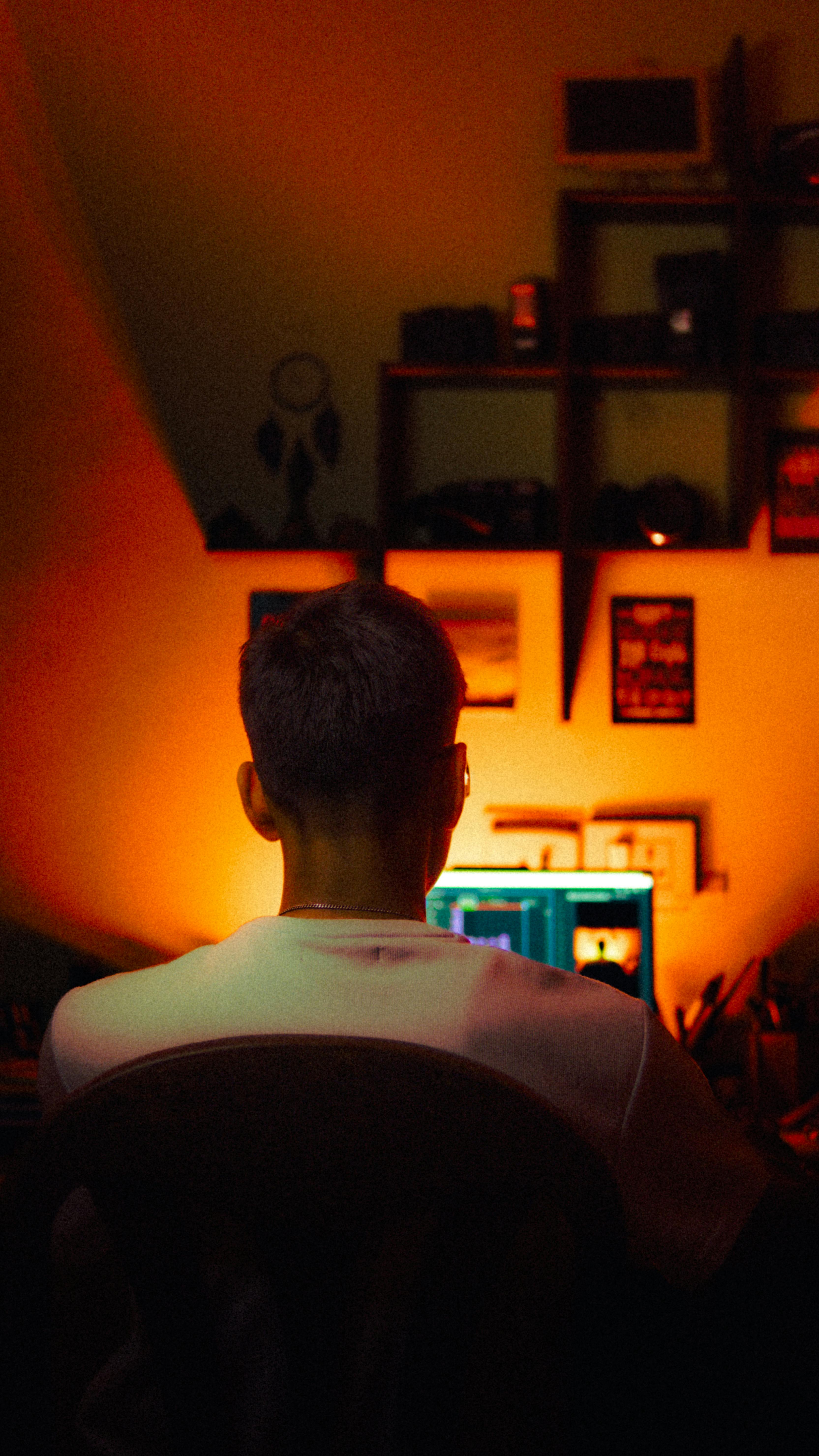Man Using Computer Sitting on Chair · Free Stock Photo