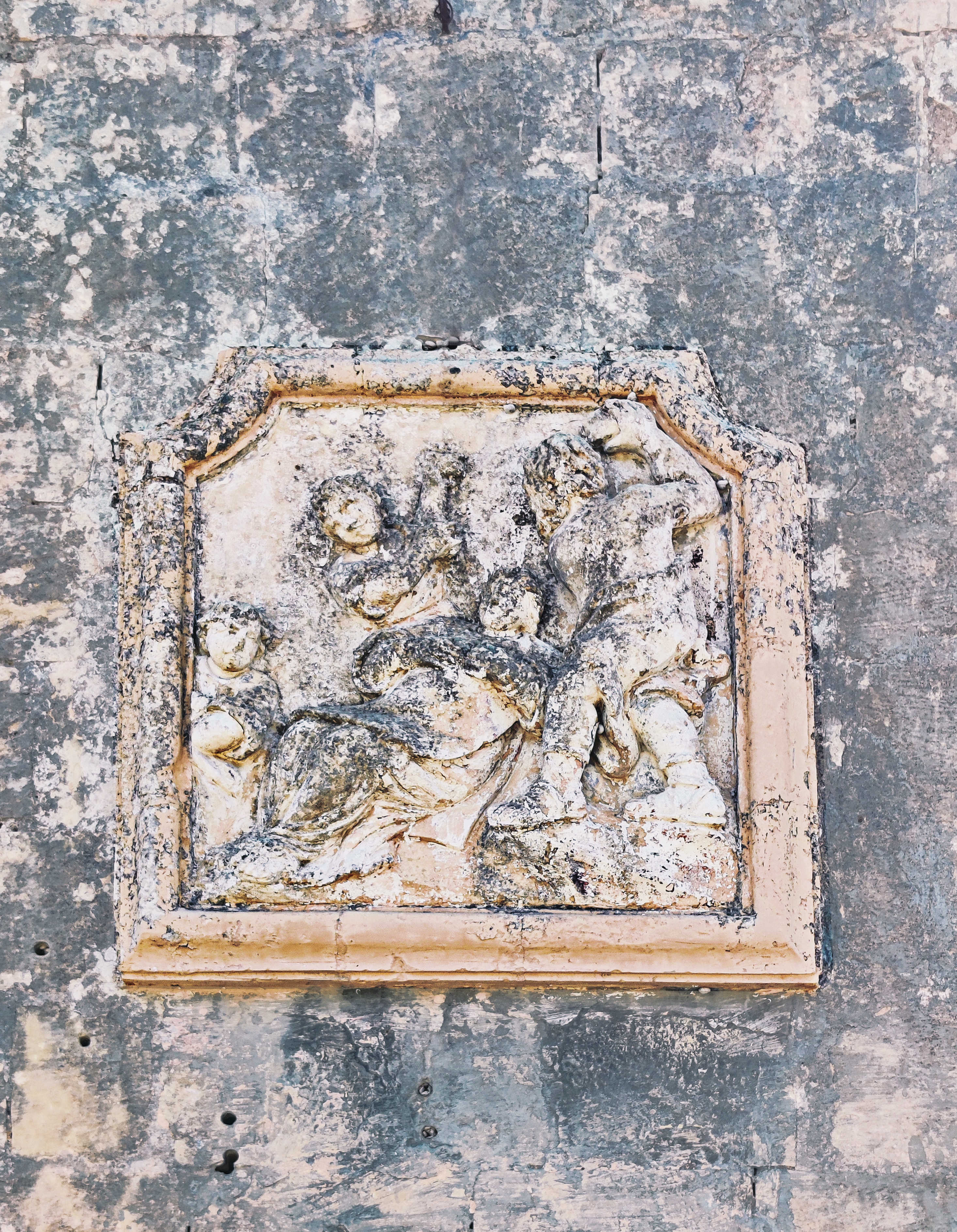 Ancient Stone Relief on Weathered Wall in Malta · Free Stock Photo