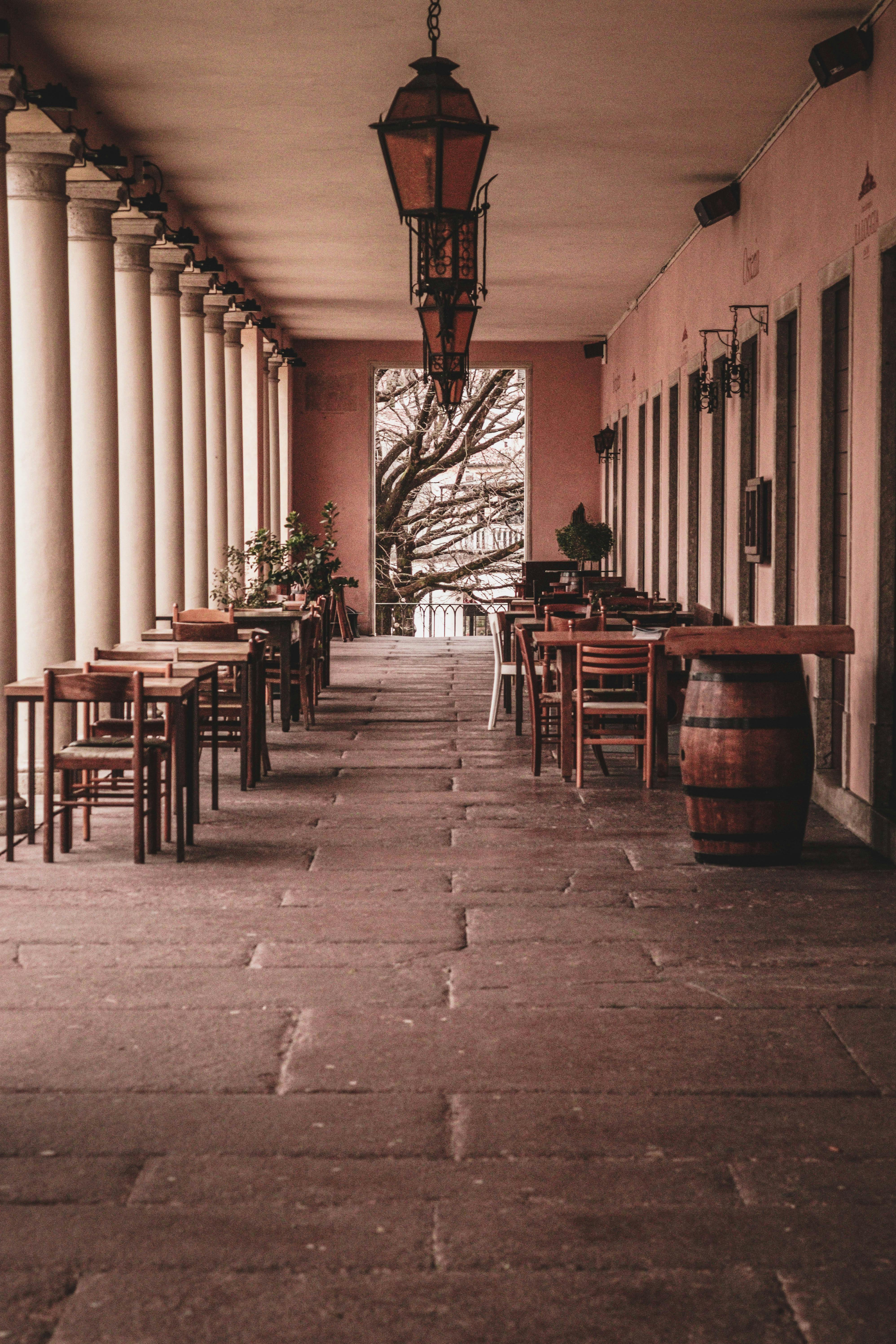 Cozy Outdoor Restaurant Corridor with Rustic Charm · Free Stock Photo