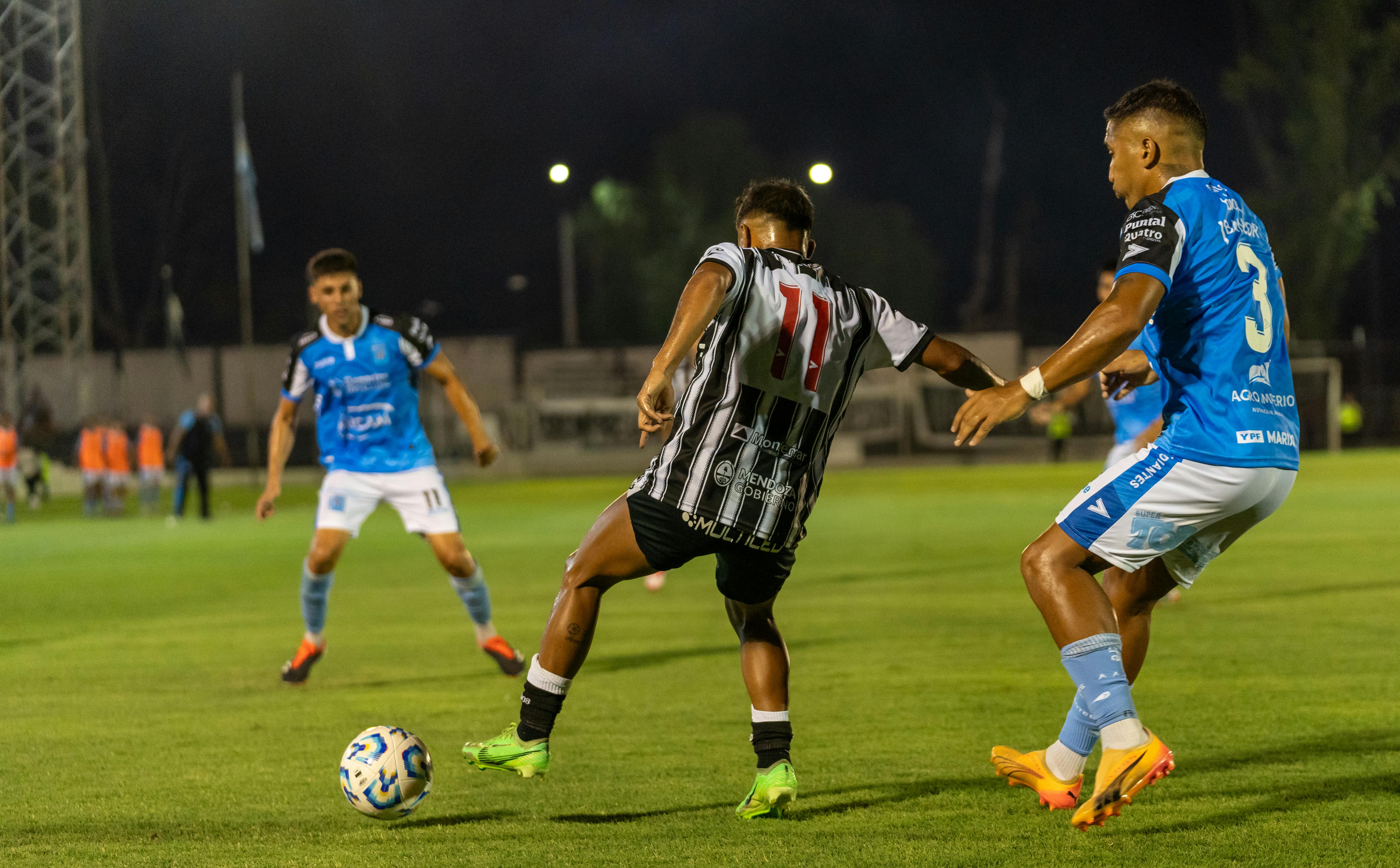 Intense Night Football Match Action · Free Stock Photo