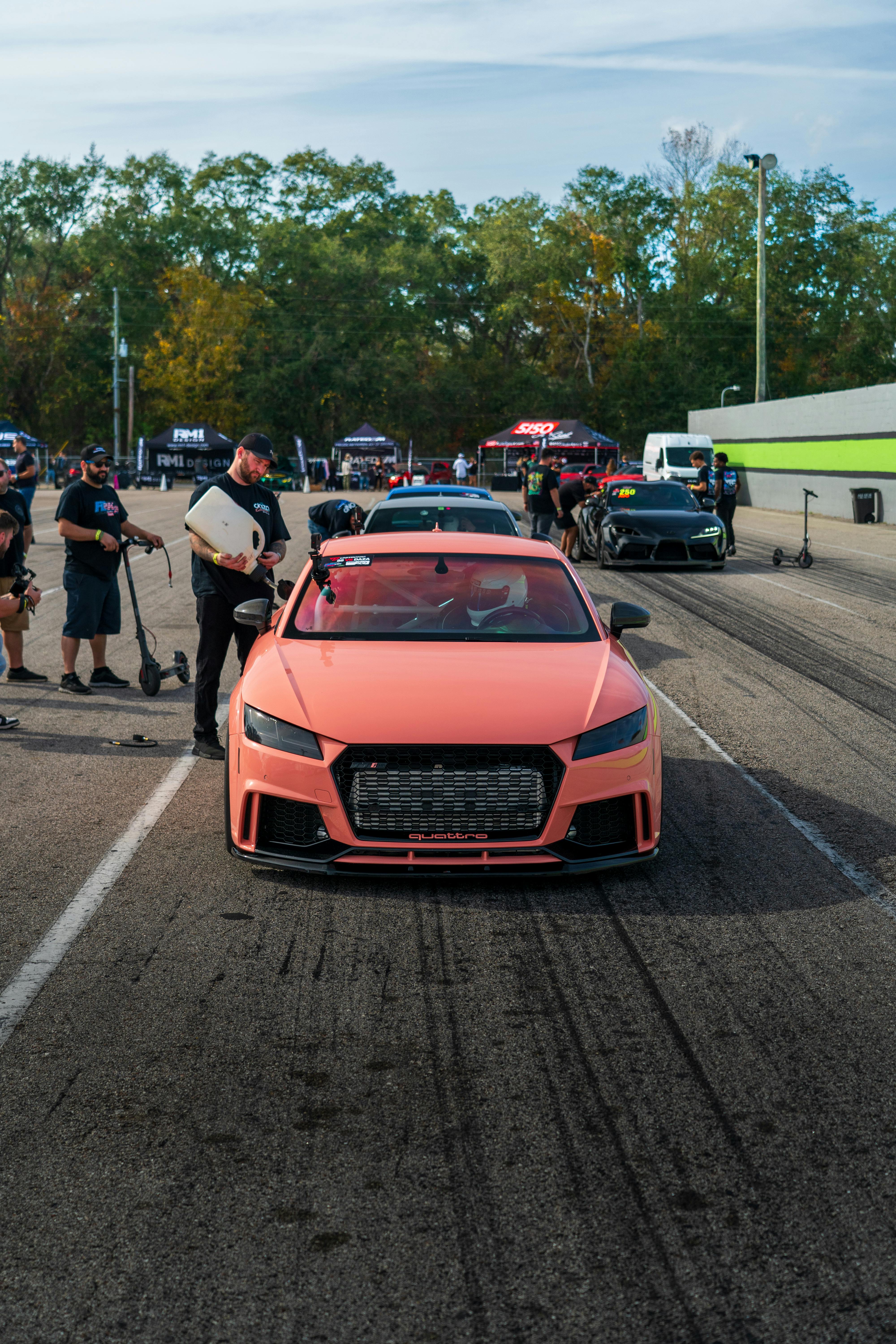 Vibrant Racing Cars at Outdoor Event · Free Stock Photo