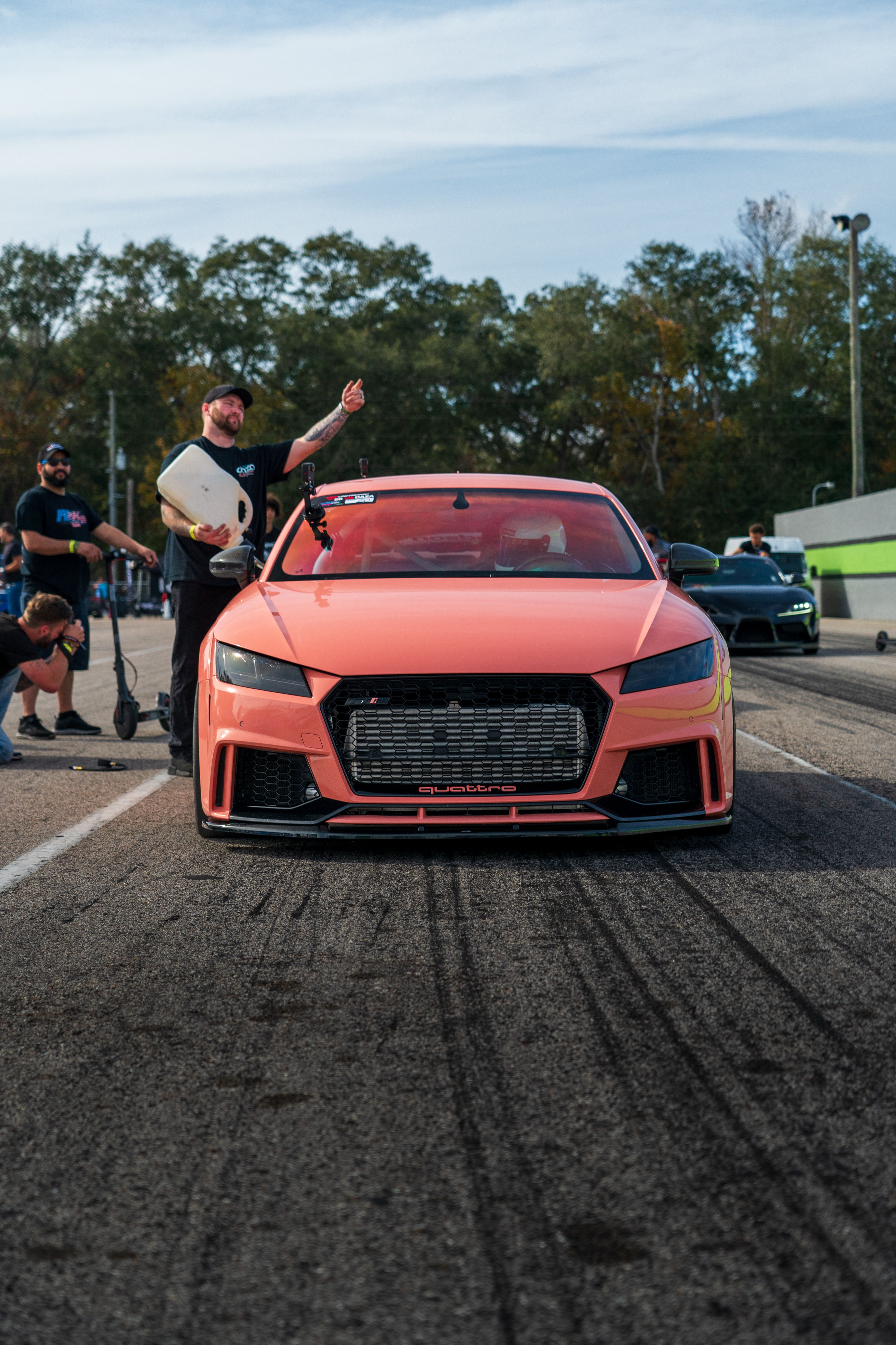 Vibrant Orange Sports Car on Race Track · Free Stock Photo