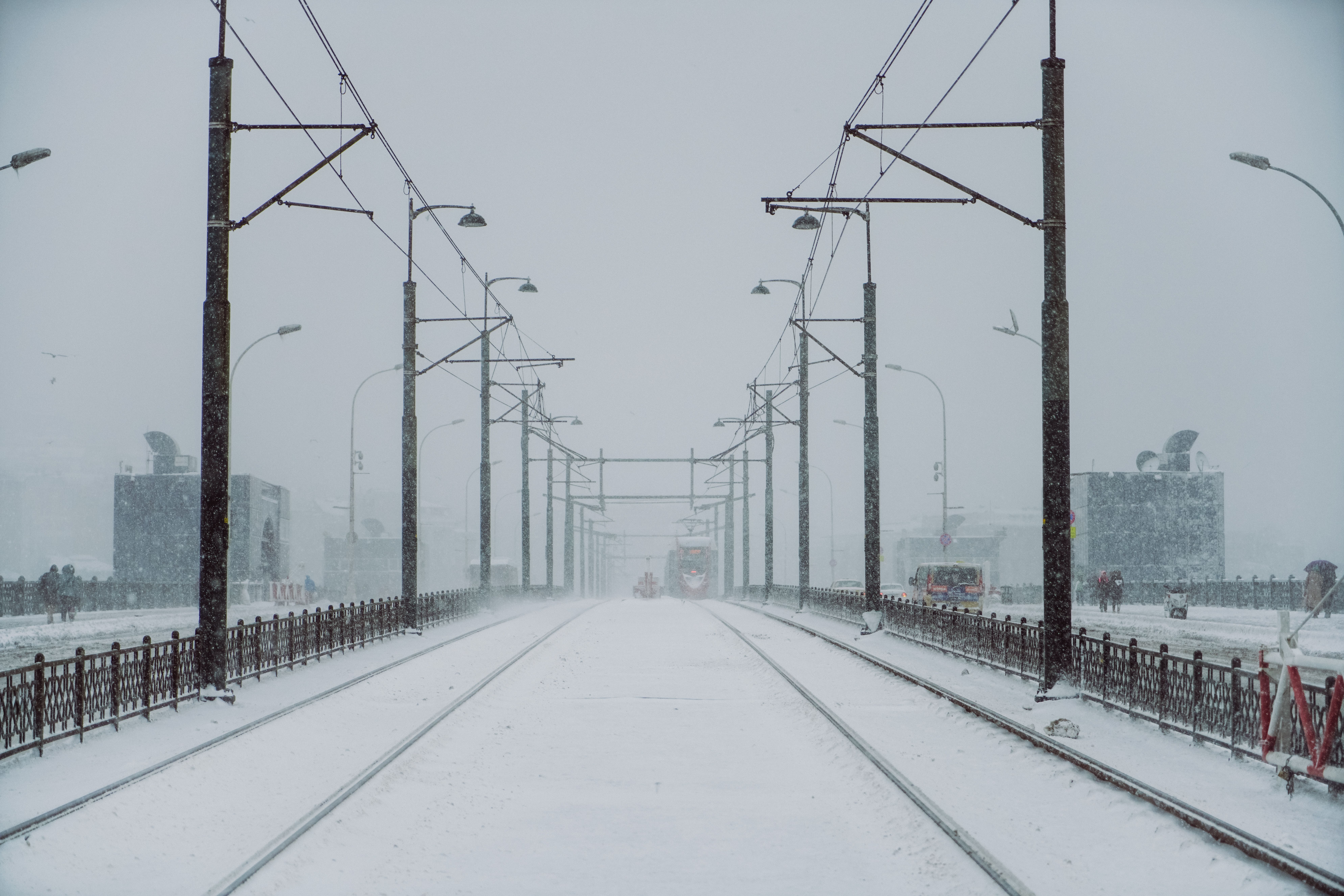 Snowy Urban Street with Tram Tracks · Free Stock Photo