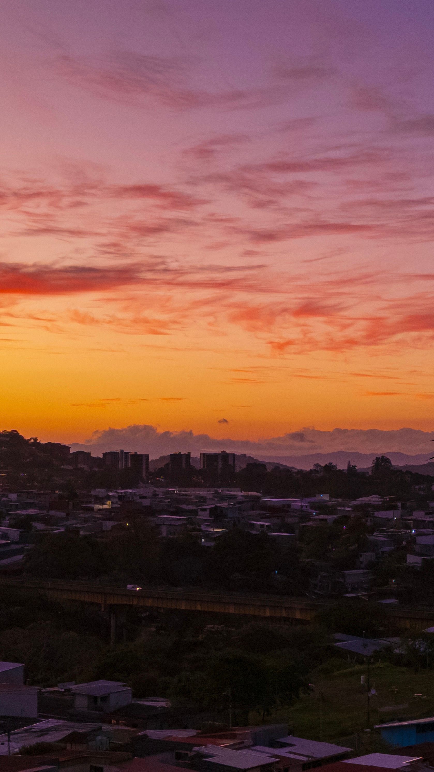 Vibrant Urban Sunset Over Cityscape Horizon · Free Stock Photo