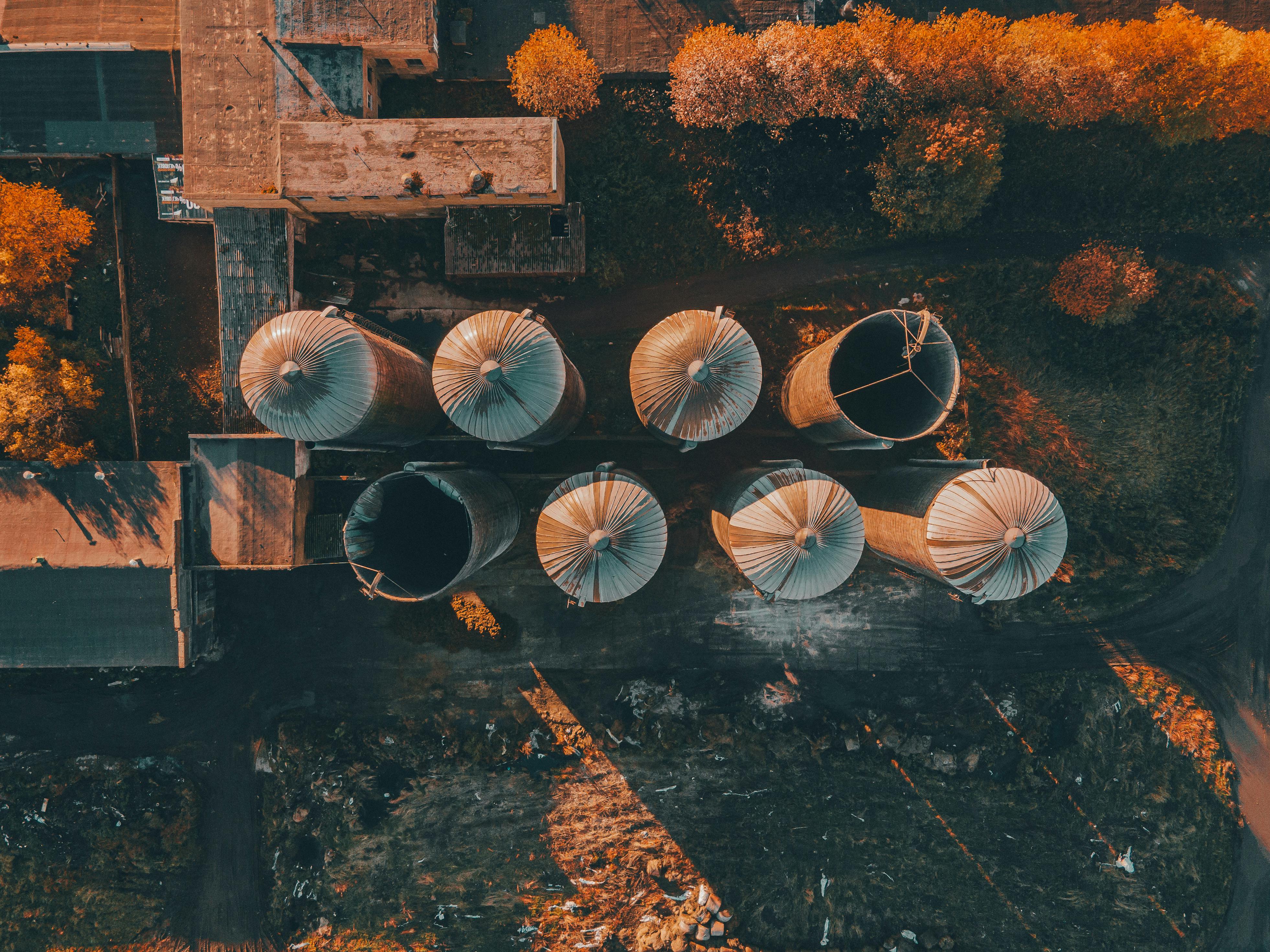Aerial View of Industrial Silos in Autumn · Free Stock Photo