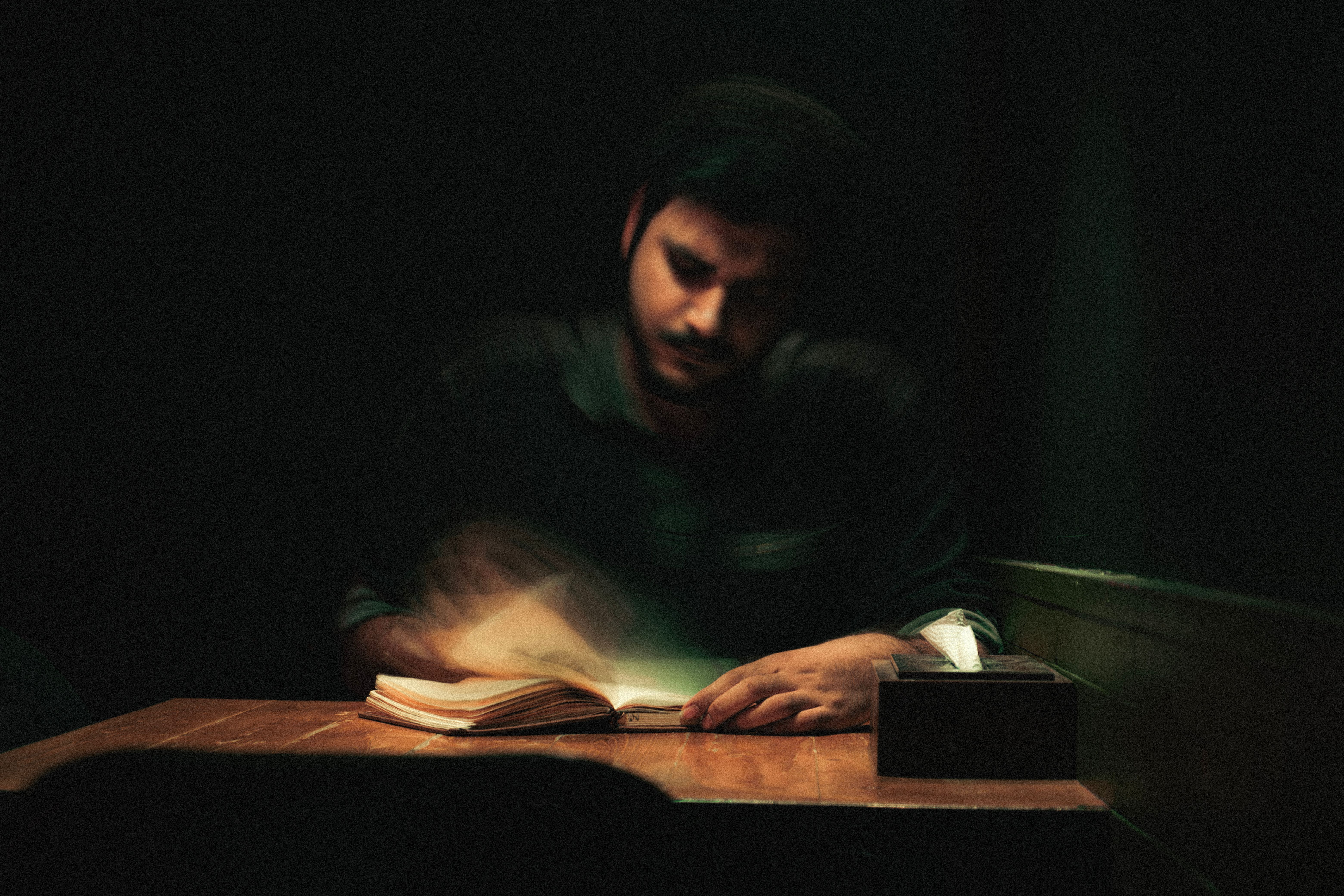 Moody Indoor Reading Scene with Motion Blur · Free Stock Photo