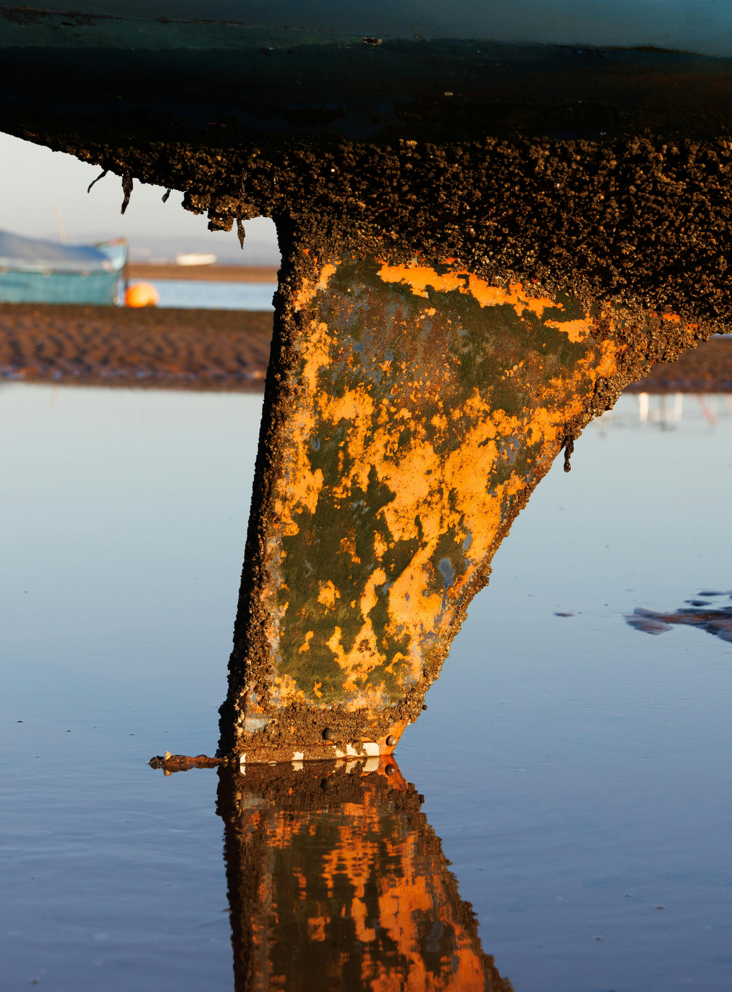Close-up of Weathered Boat Keel with Reflections · Free Stock Photo